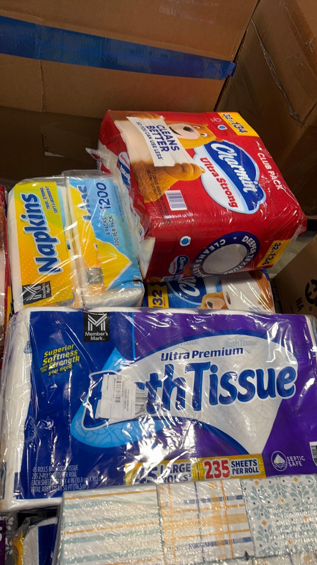 pallet of toilet paper, paper towels and Kleenex
