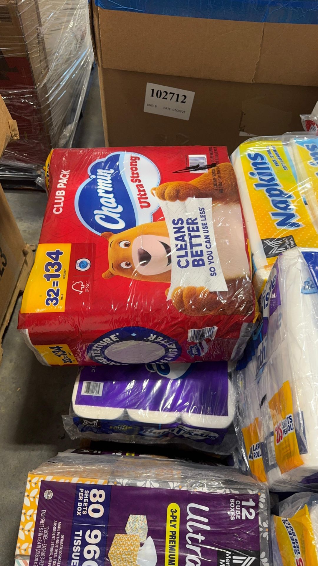 pallet of toilet paper, paper towels and Kleenex