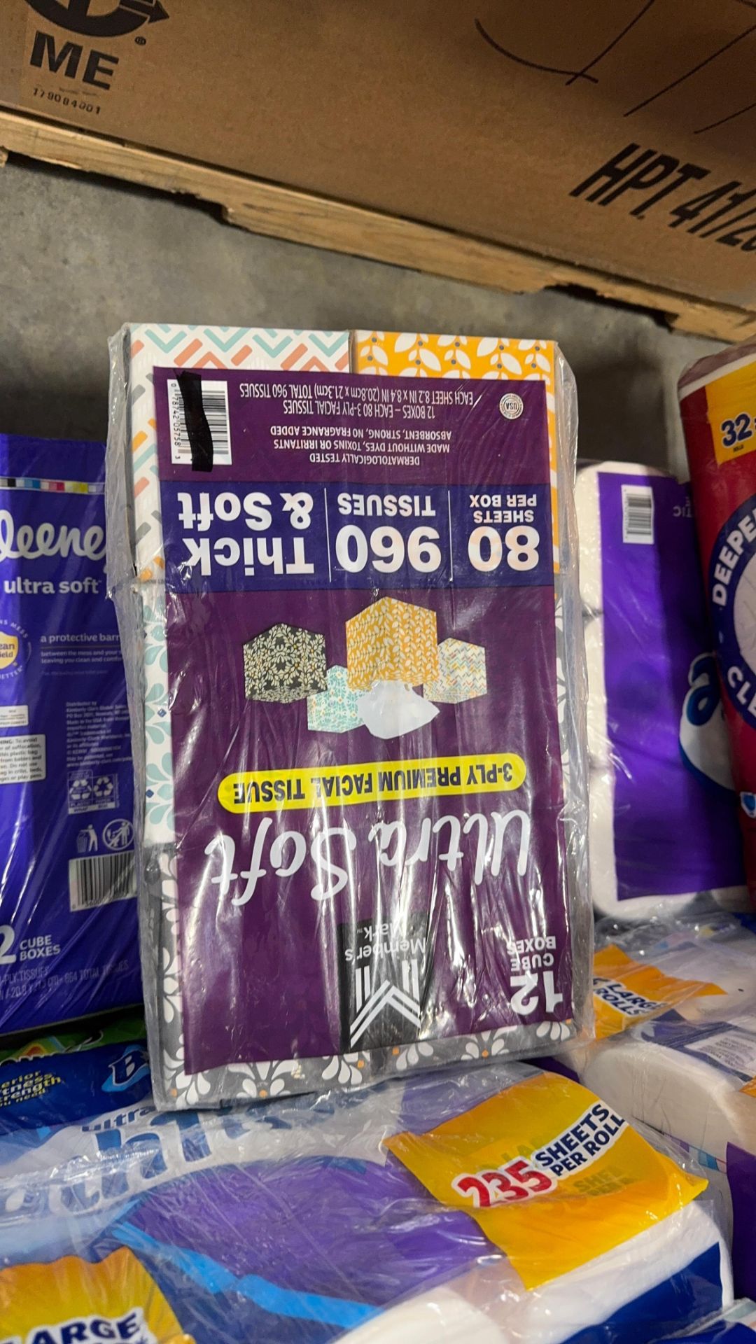 pallet of toilet paper, paper towels and Kleenex