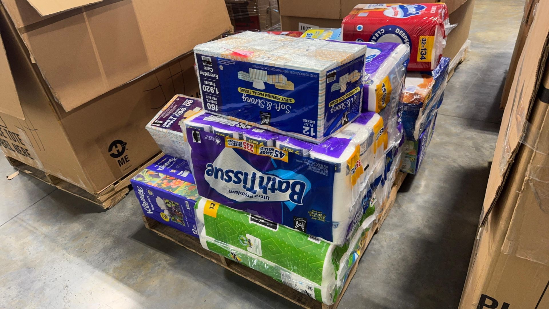 pallet of toilet paper, paper towels and Kleenex