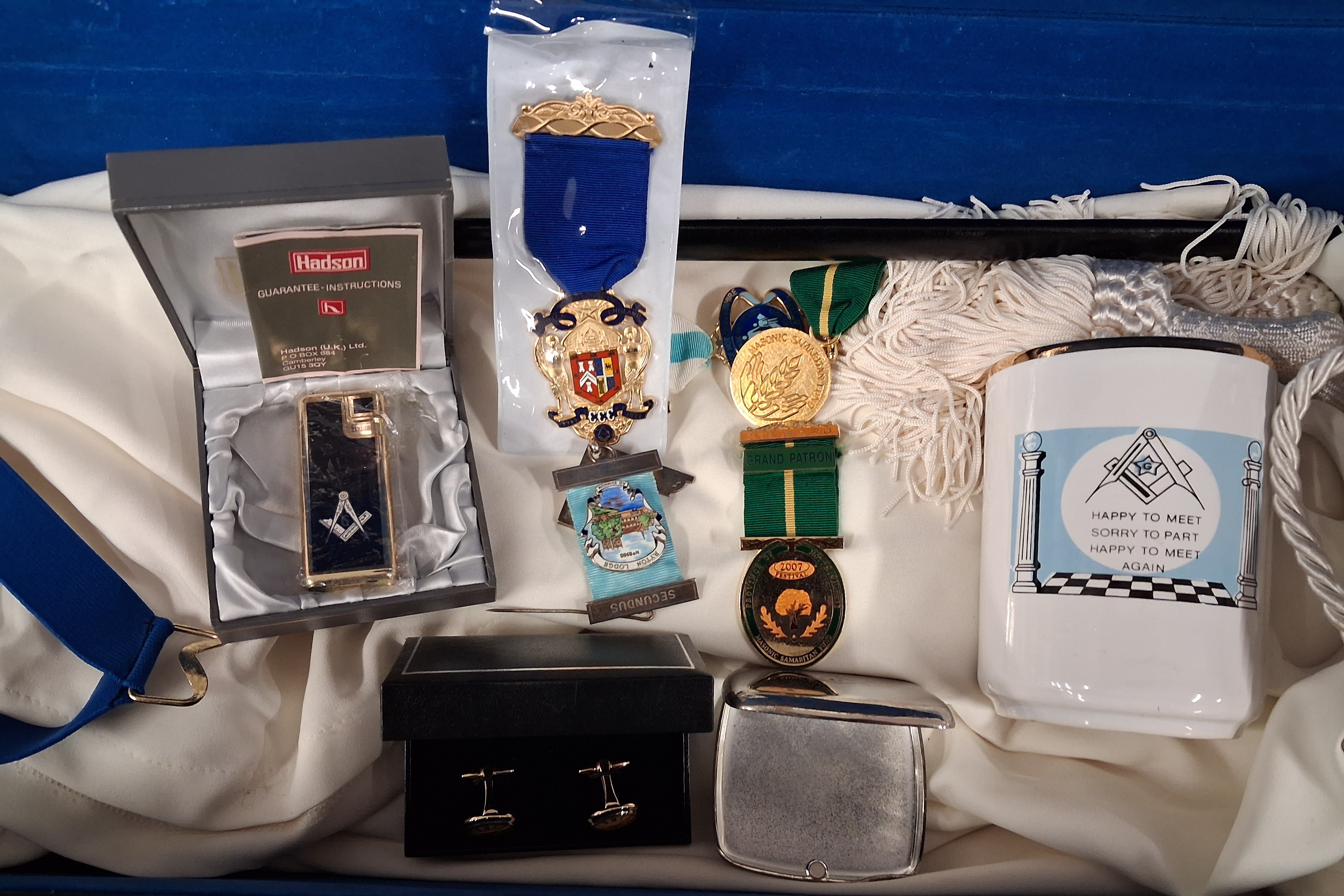 A case of Masonic regalia to include medals, cufflinks, mug, watch ...