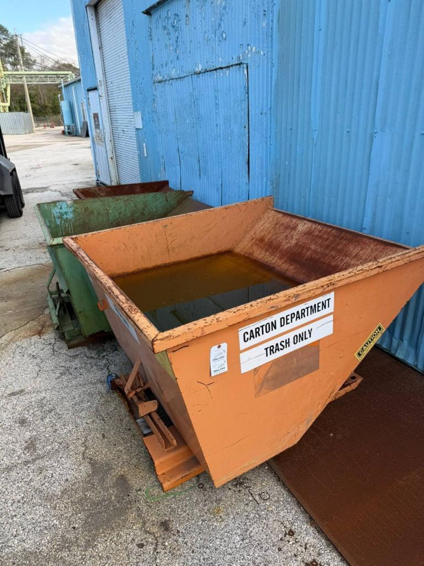 This lot includes three used self-dumping hoppers designed for ...