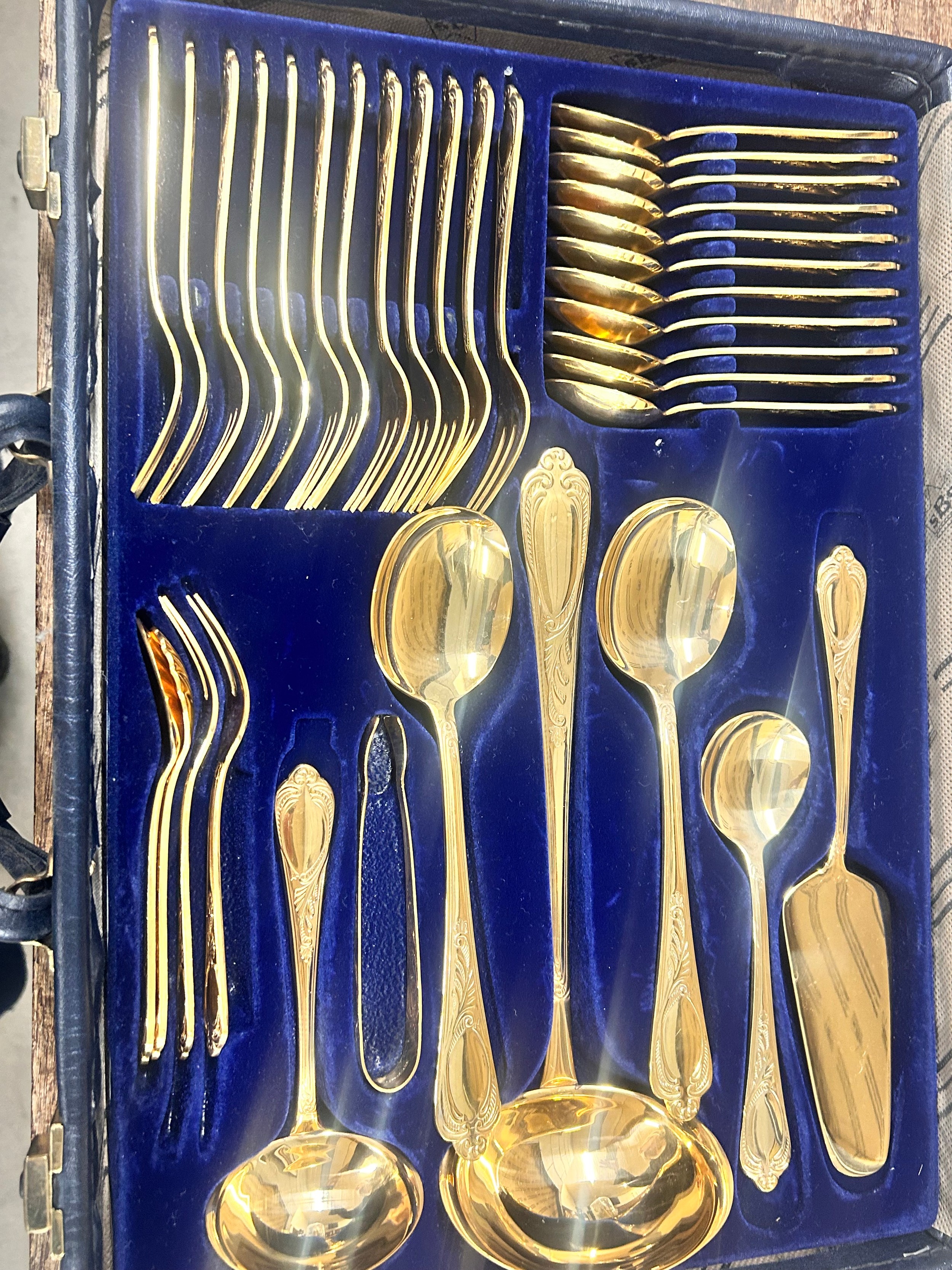 A Solingen Bestecke seventy piece gold plated canteen of cutlery, cased
