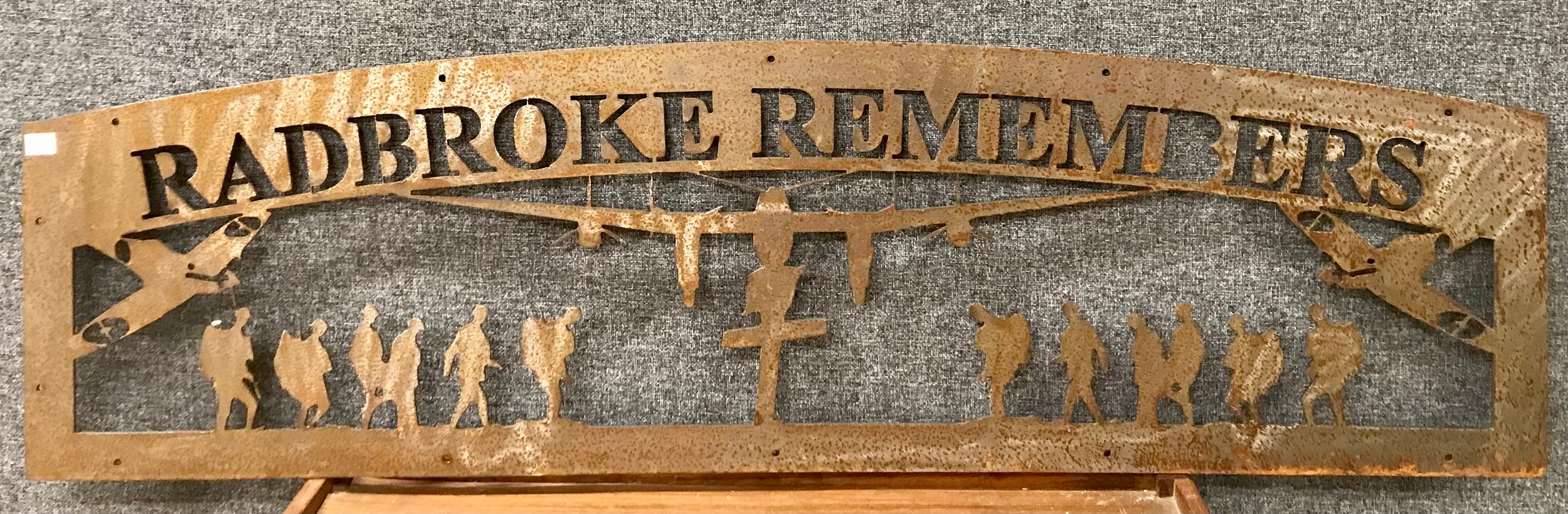 A cast metal Radbroke Remembers plaque