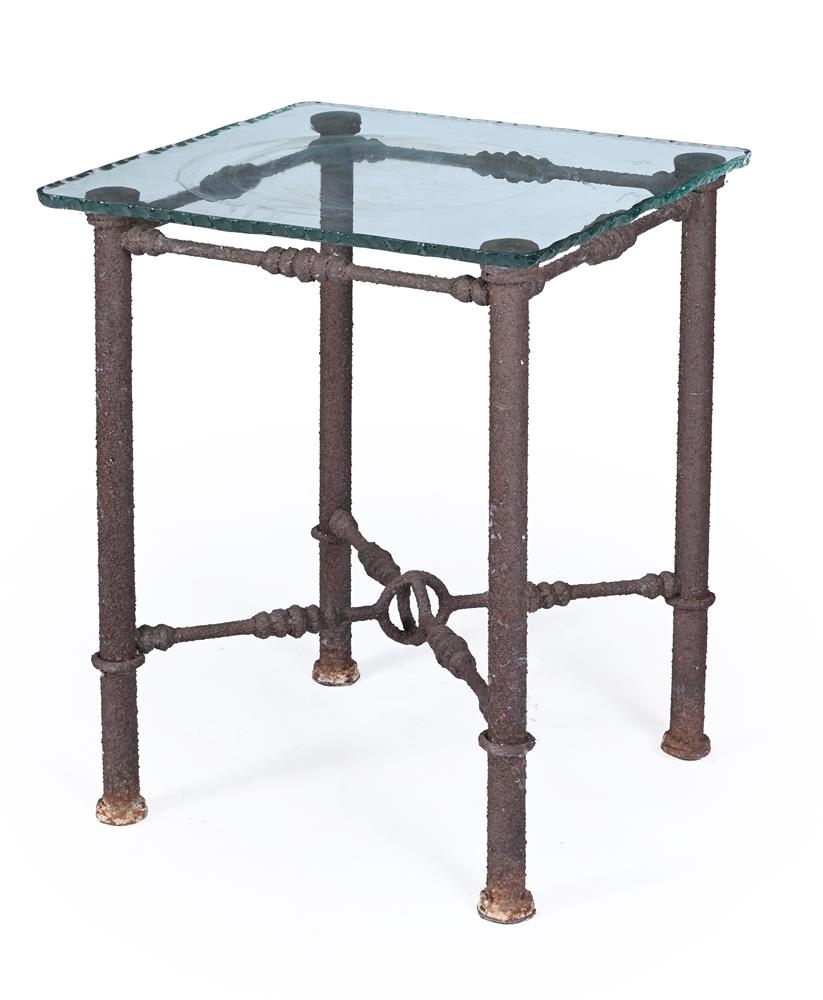 A pair of cast iron garden/conservatory tables with glass tops, each ...