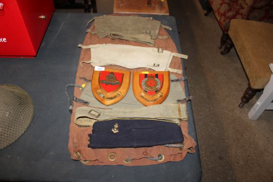 A selection of WWII dated canvas spats, two regimental plaques and a ...
