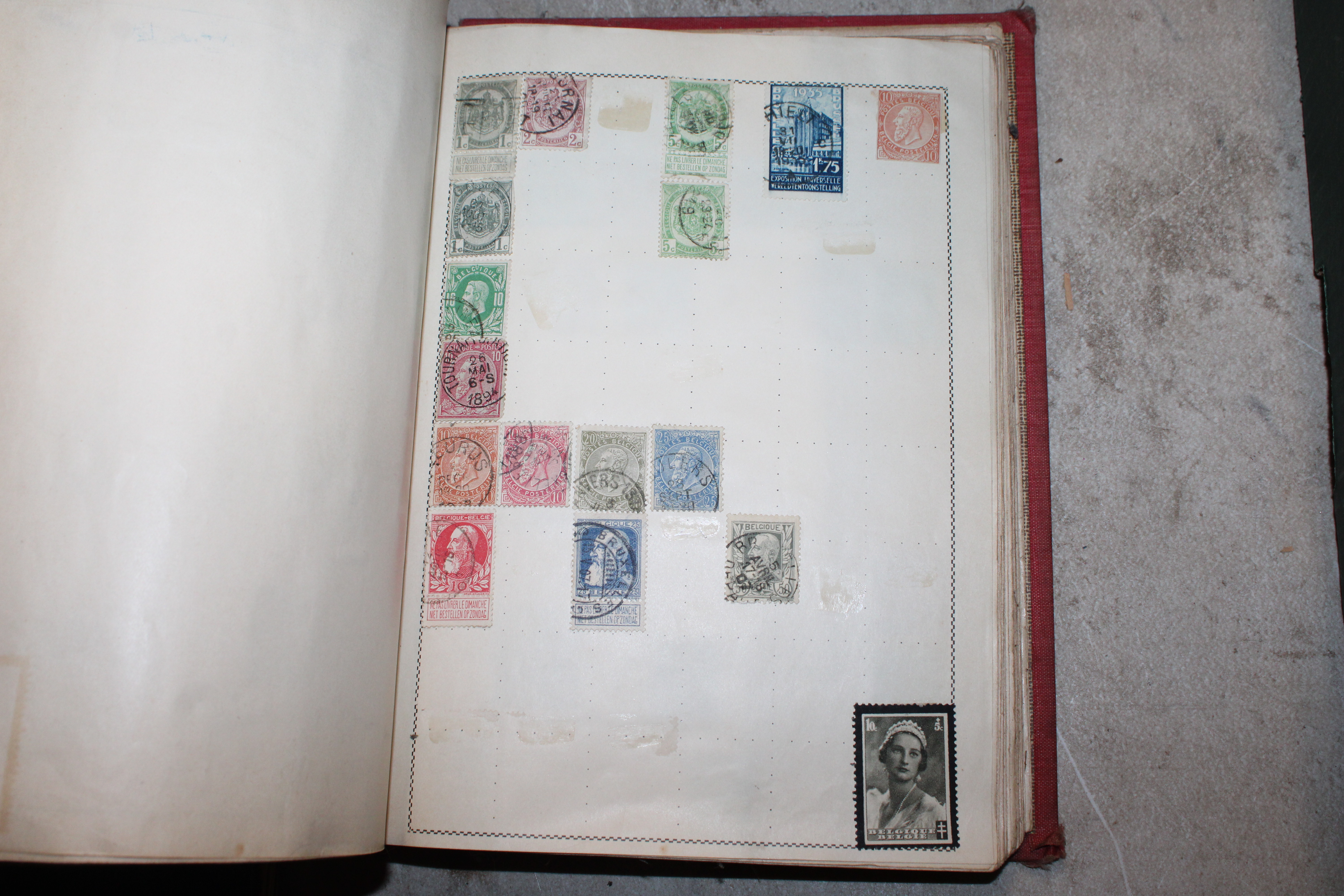 A box containing seven stamp albums and contents