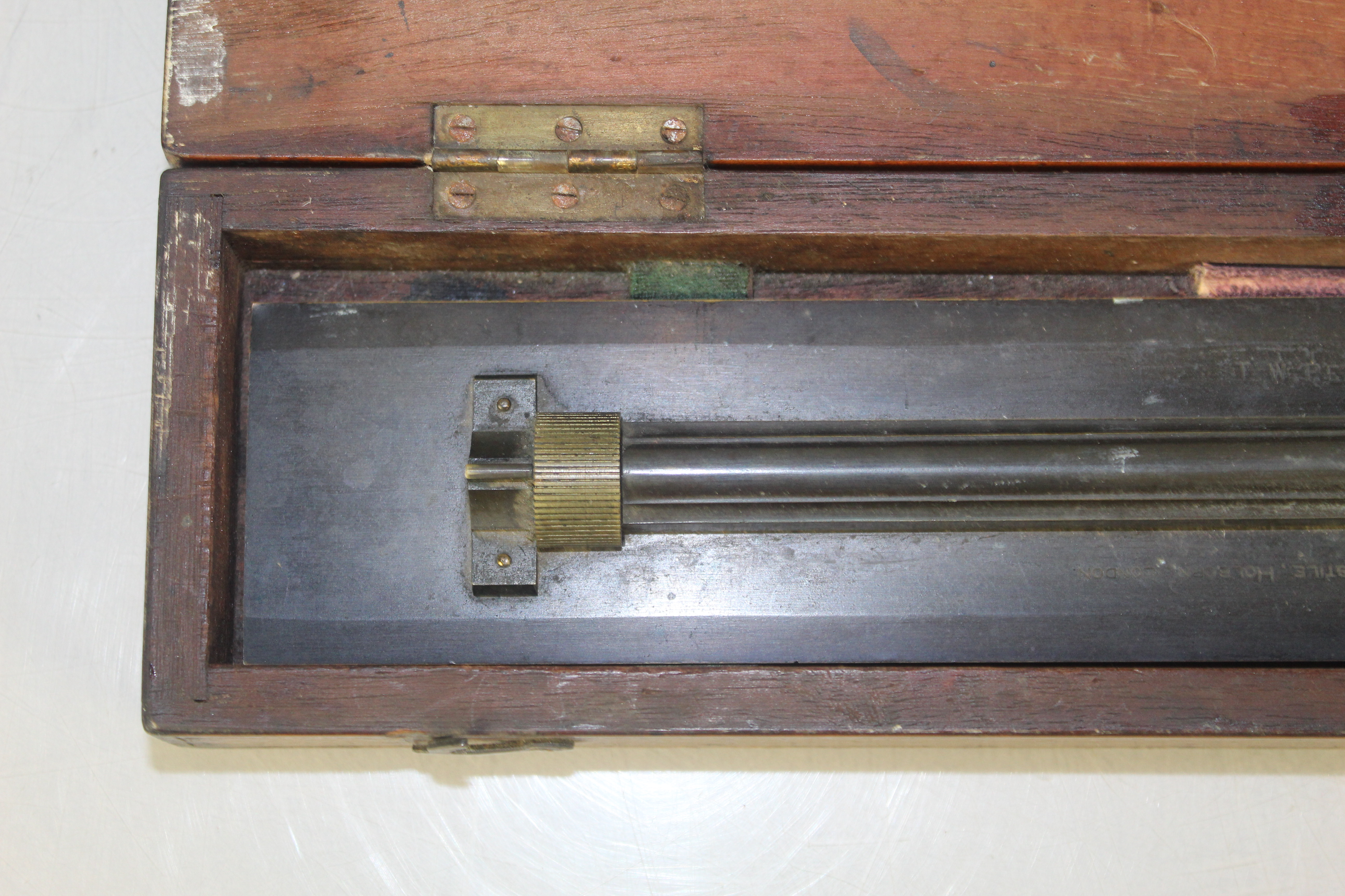 A 19th Century brass parallel roll in mahogany case