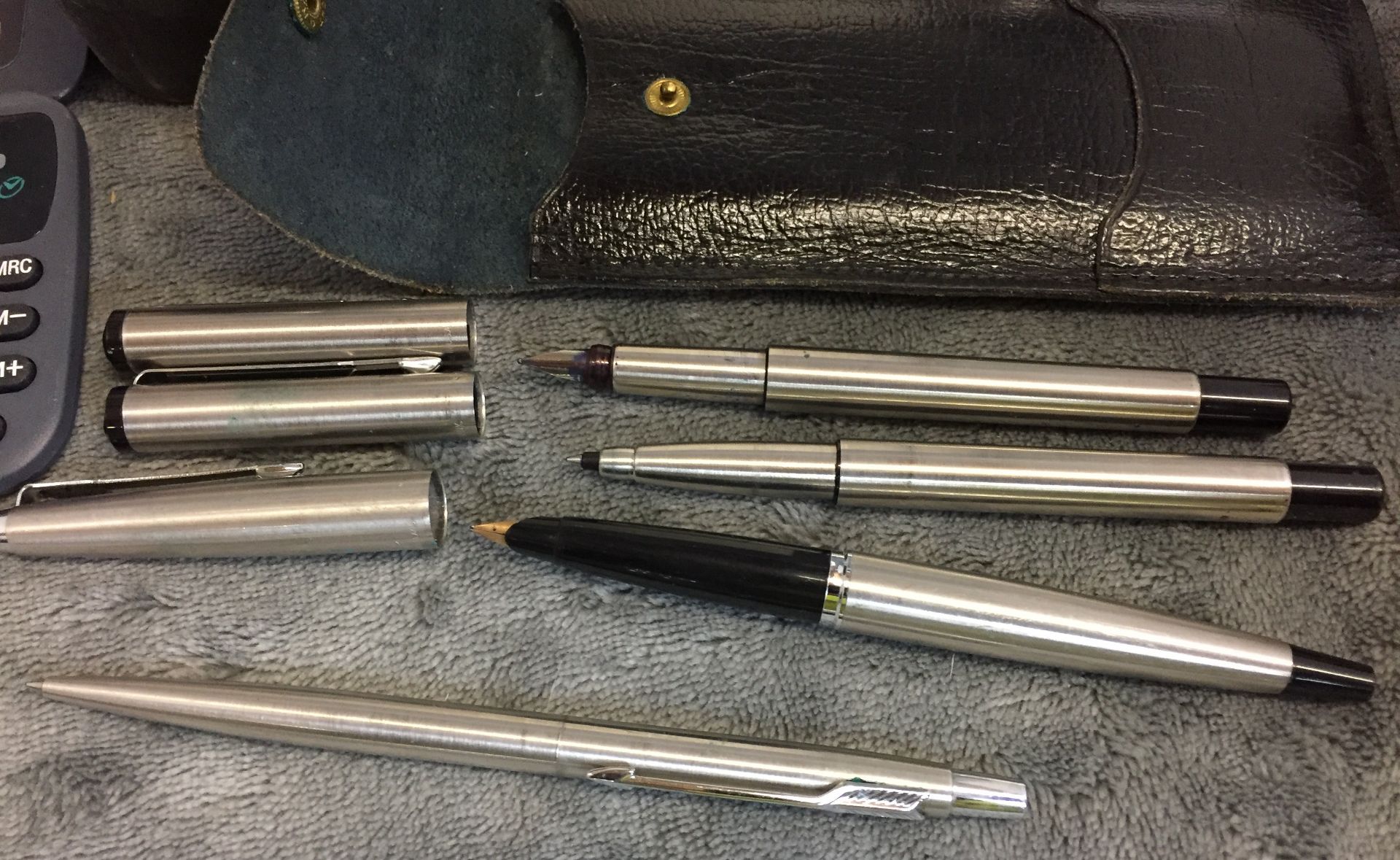 Twenty-six items including four parker pens, music box mechanism ...