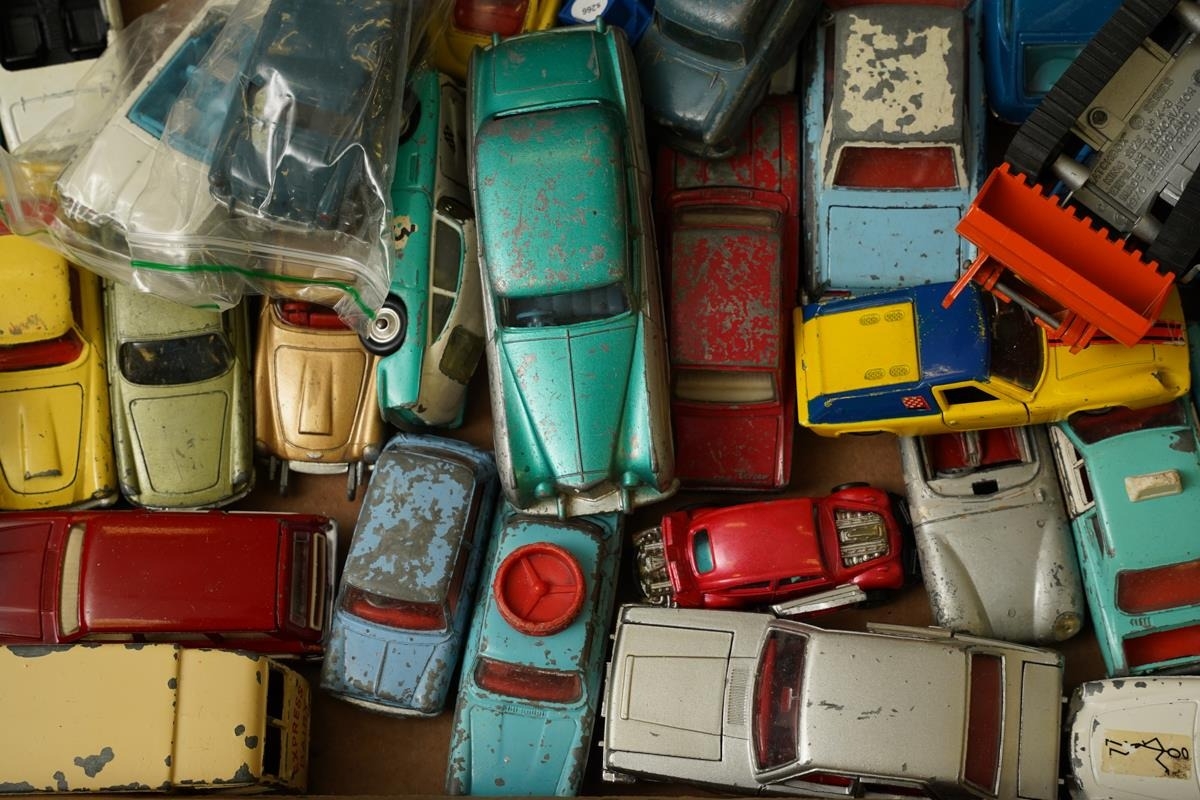A box of assorted cars, horse boxes and the makers are Triang, Corgi ...