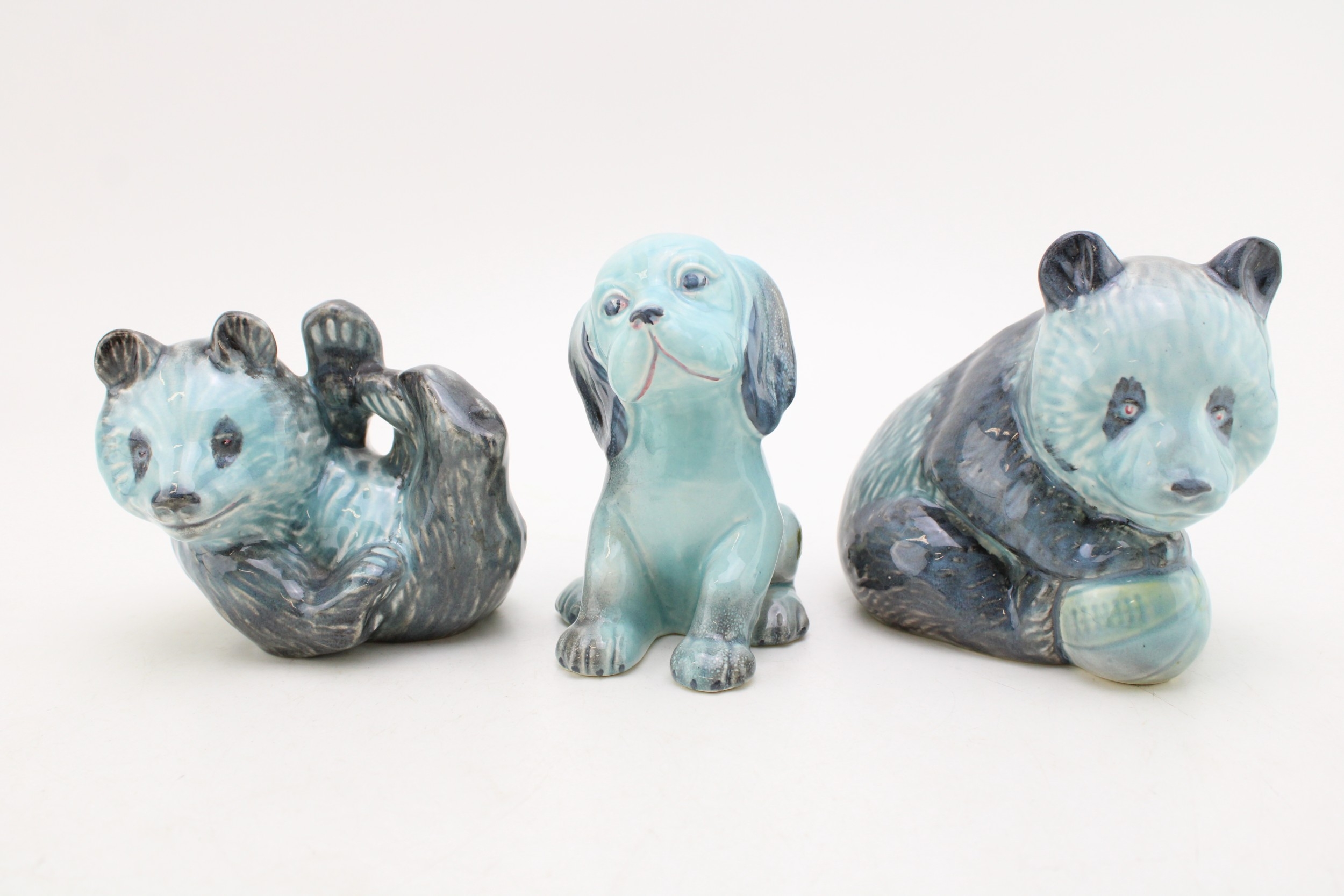 A pair of blue Beswick panda bears, with a lollopy dog (3). In good ...