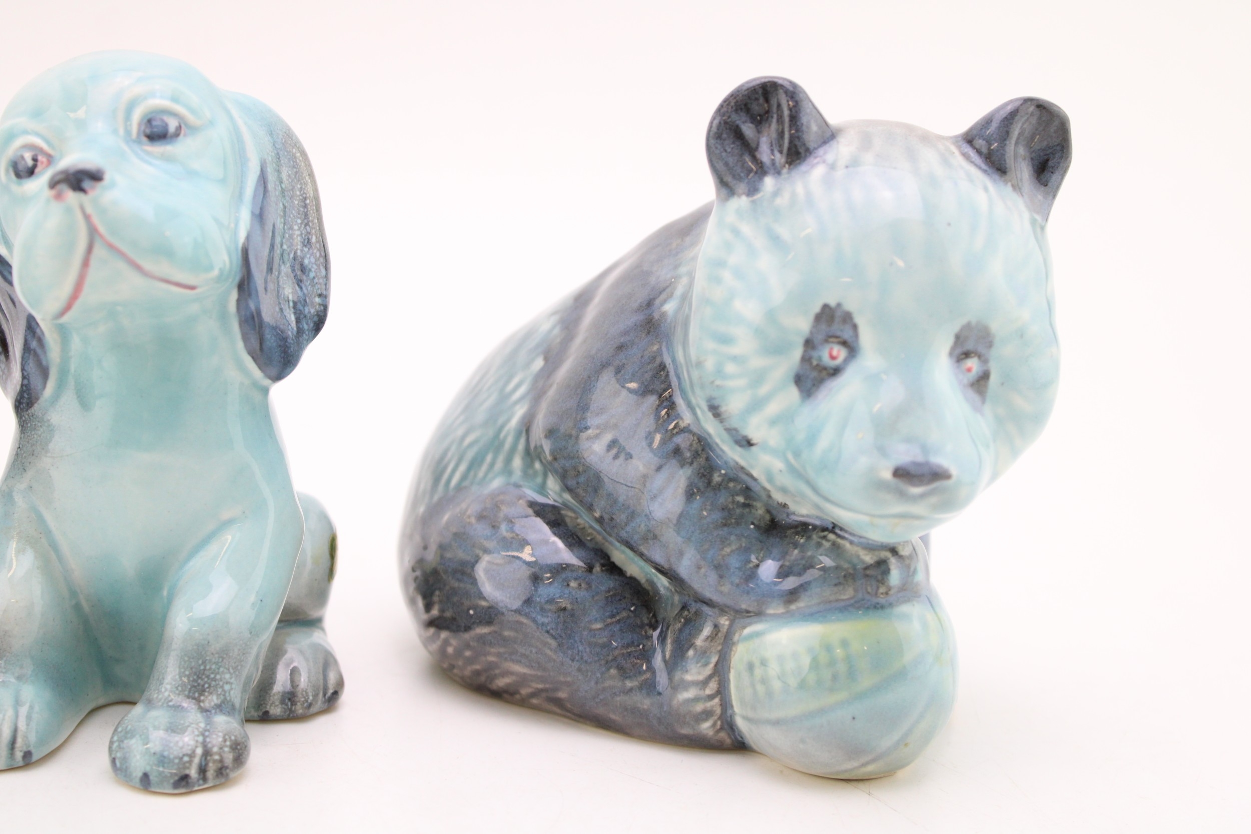 A pair of blue Beswick panda bears, with a lollopy dog (3). In good ...