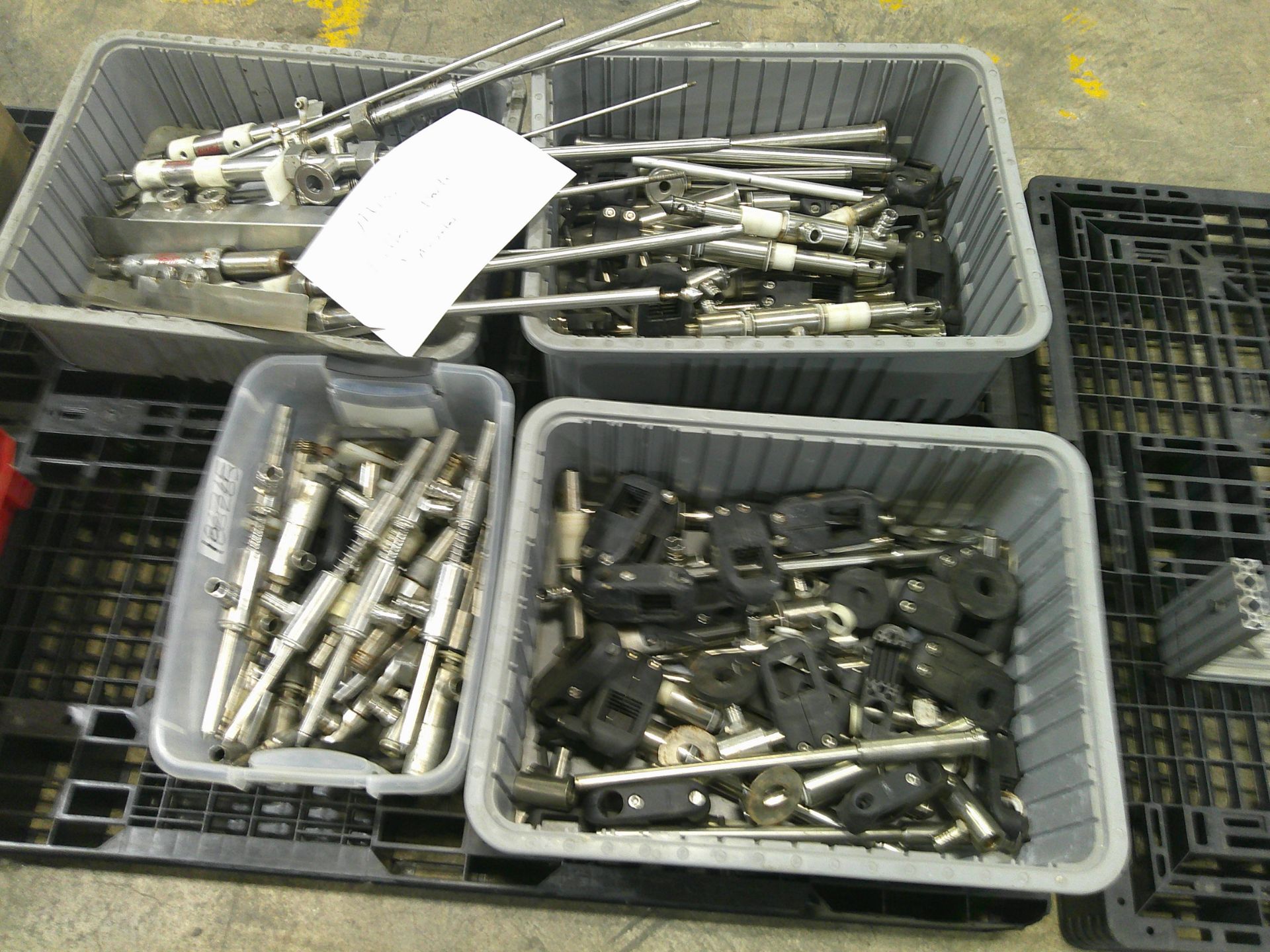6 skids - Palace unscrambler parts, cap feed parts, filler parts ...