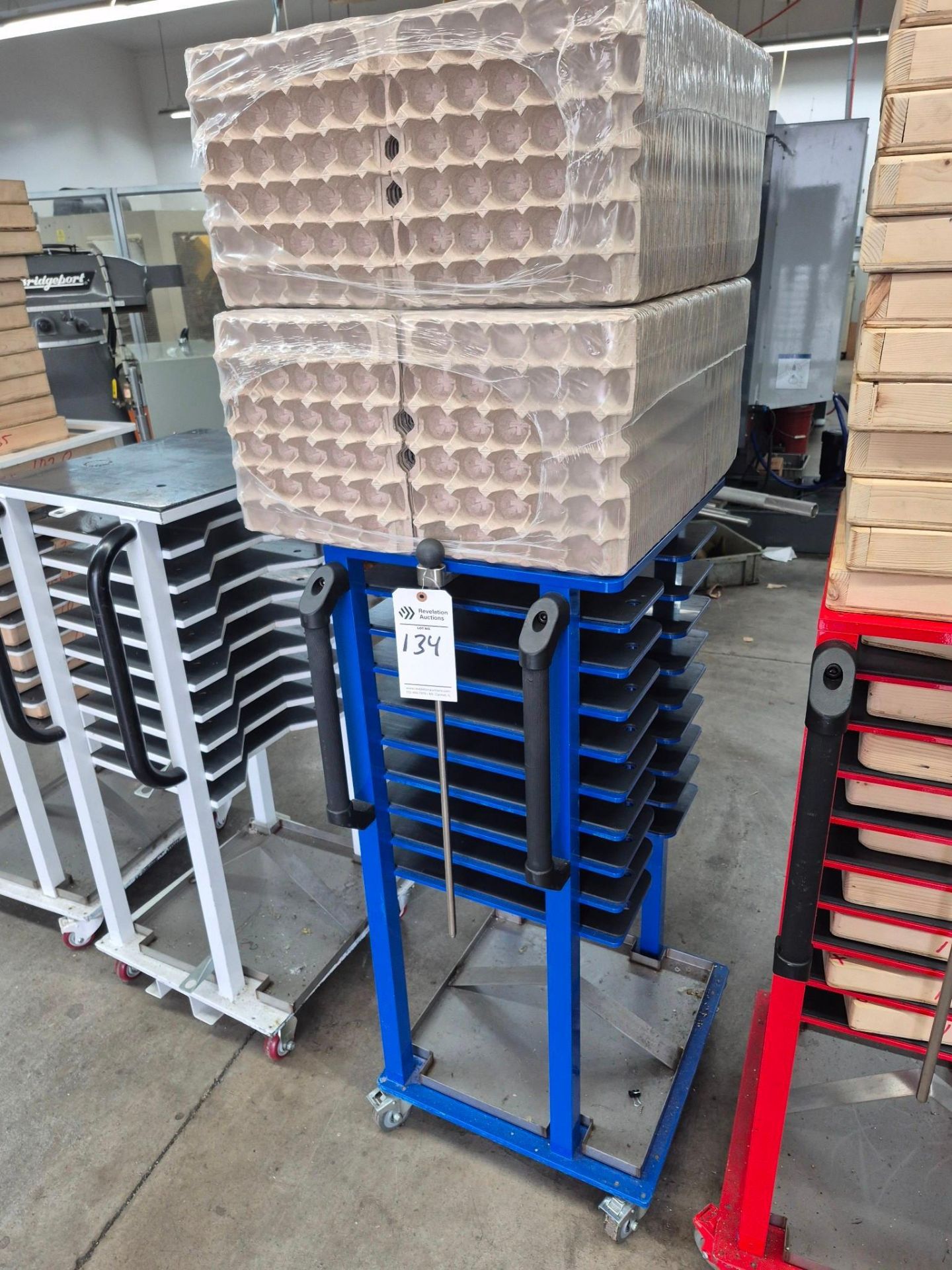 6 X 9 TRAY COMMERCIAL TRAY RACKS ON CASTORS, FILLED WITH PACKING ...