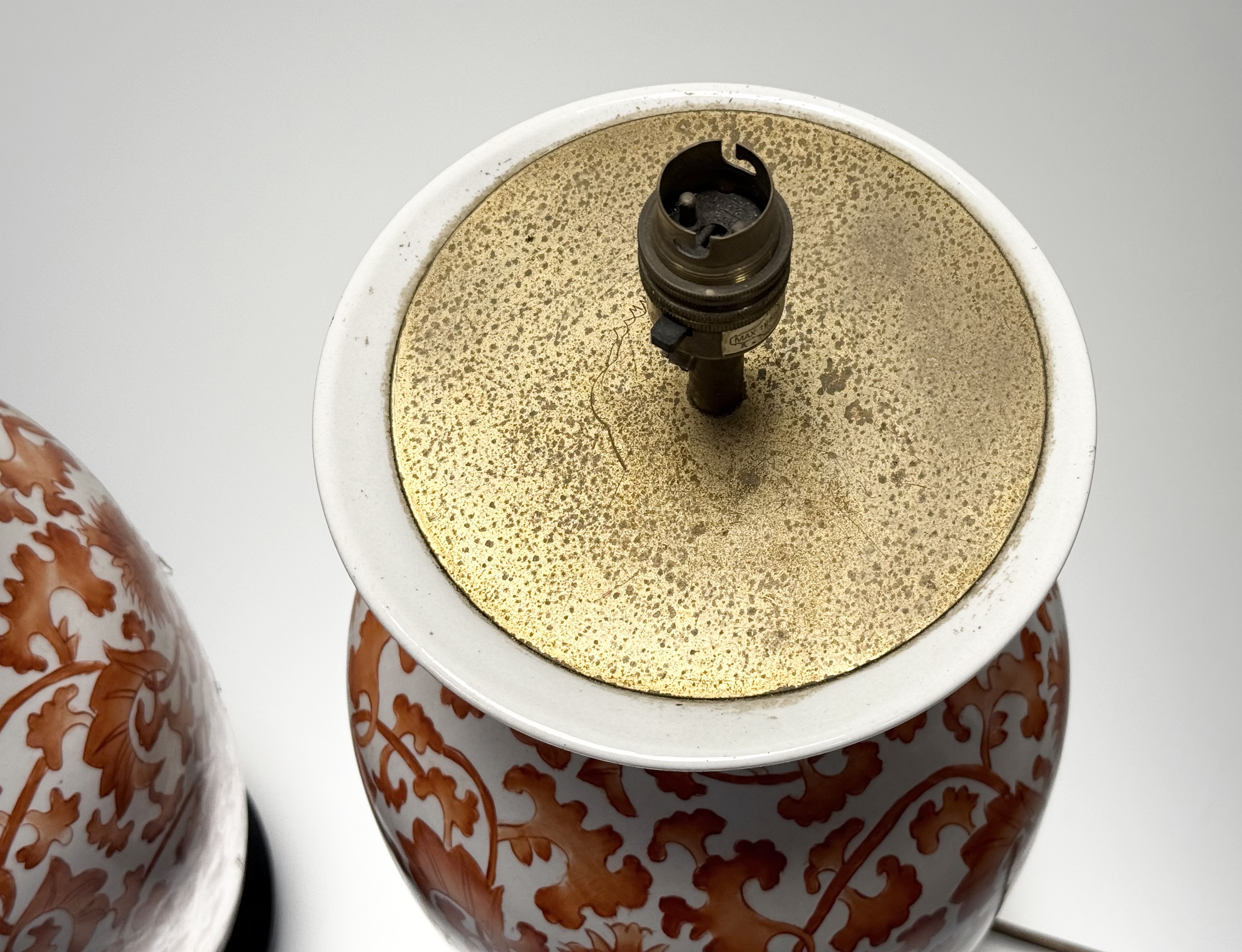 A pair of Chinese iron red painted porcelain vasiform table lamps ...