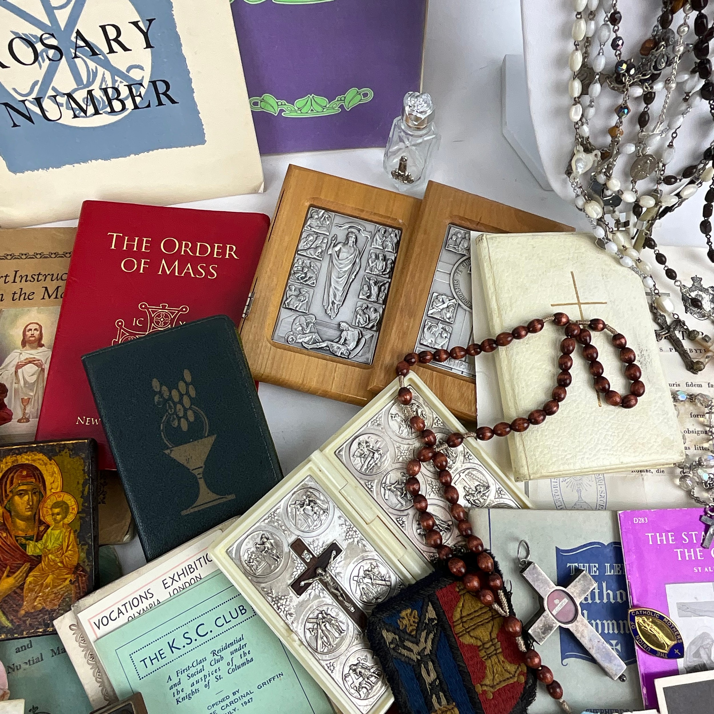 A collection of religious items to include Holy Relic of St Pius X with ...