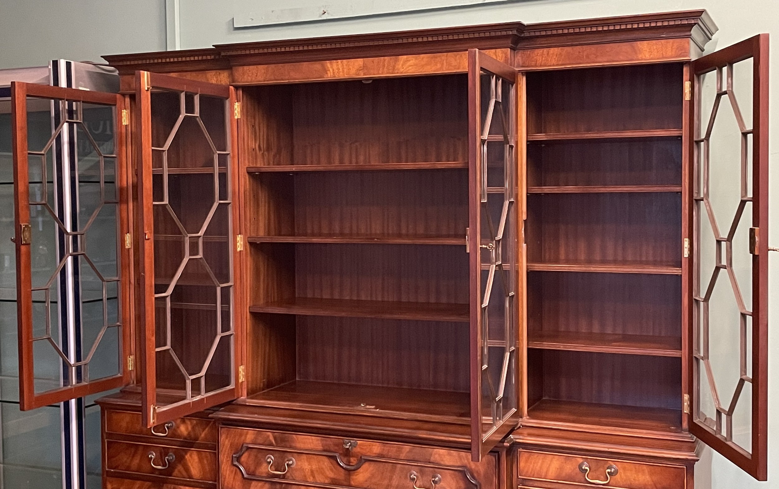 A Bevan Funnell Reprodux Georgian style flame mahogany breakfront ...