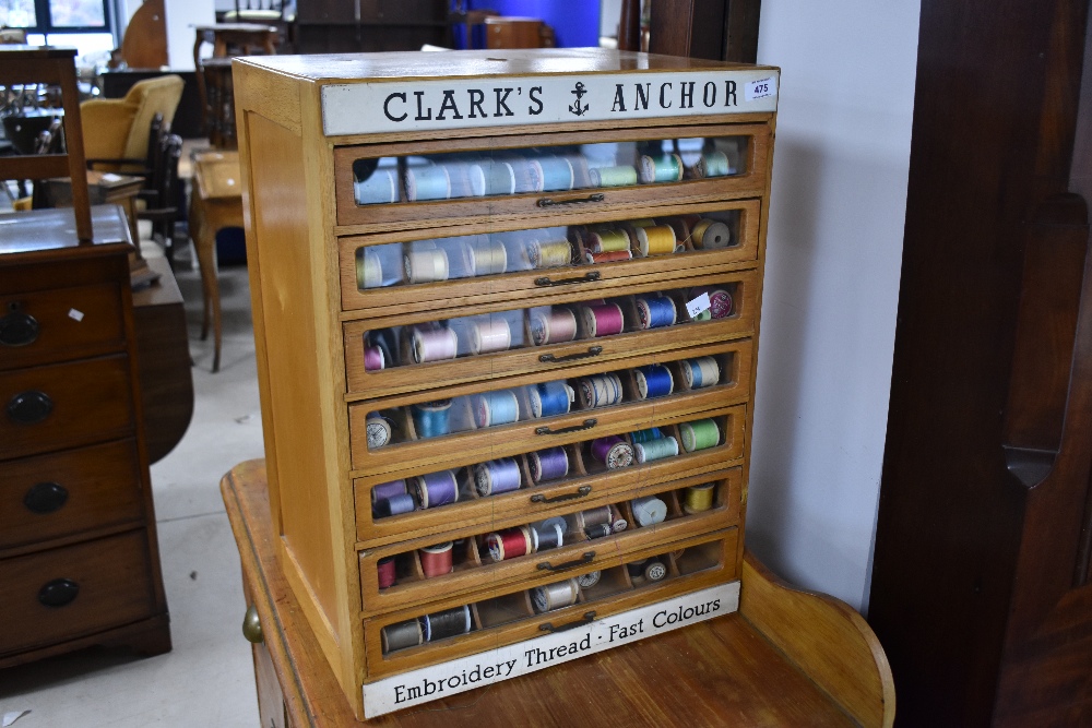 A vintage cotton reel display for Clark's Anchor , having seven divided ...