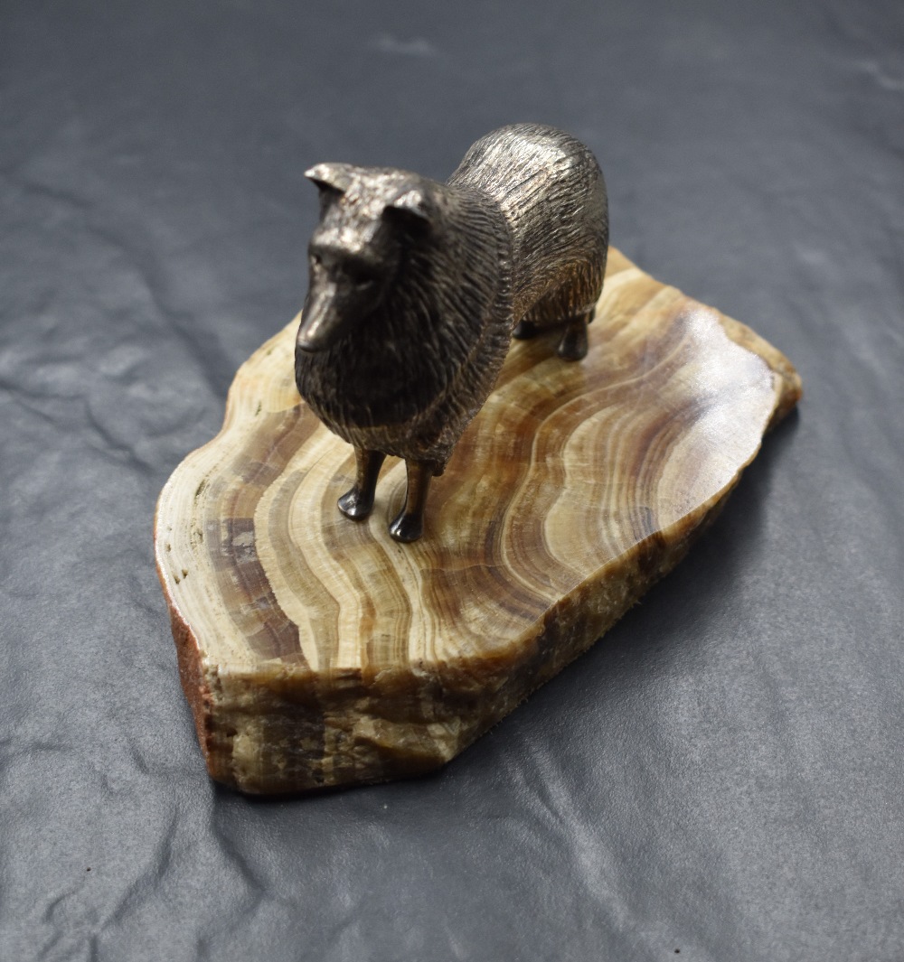 An Elizabeth II silver rough collie figure by A.F. Kelly, on a banded ...