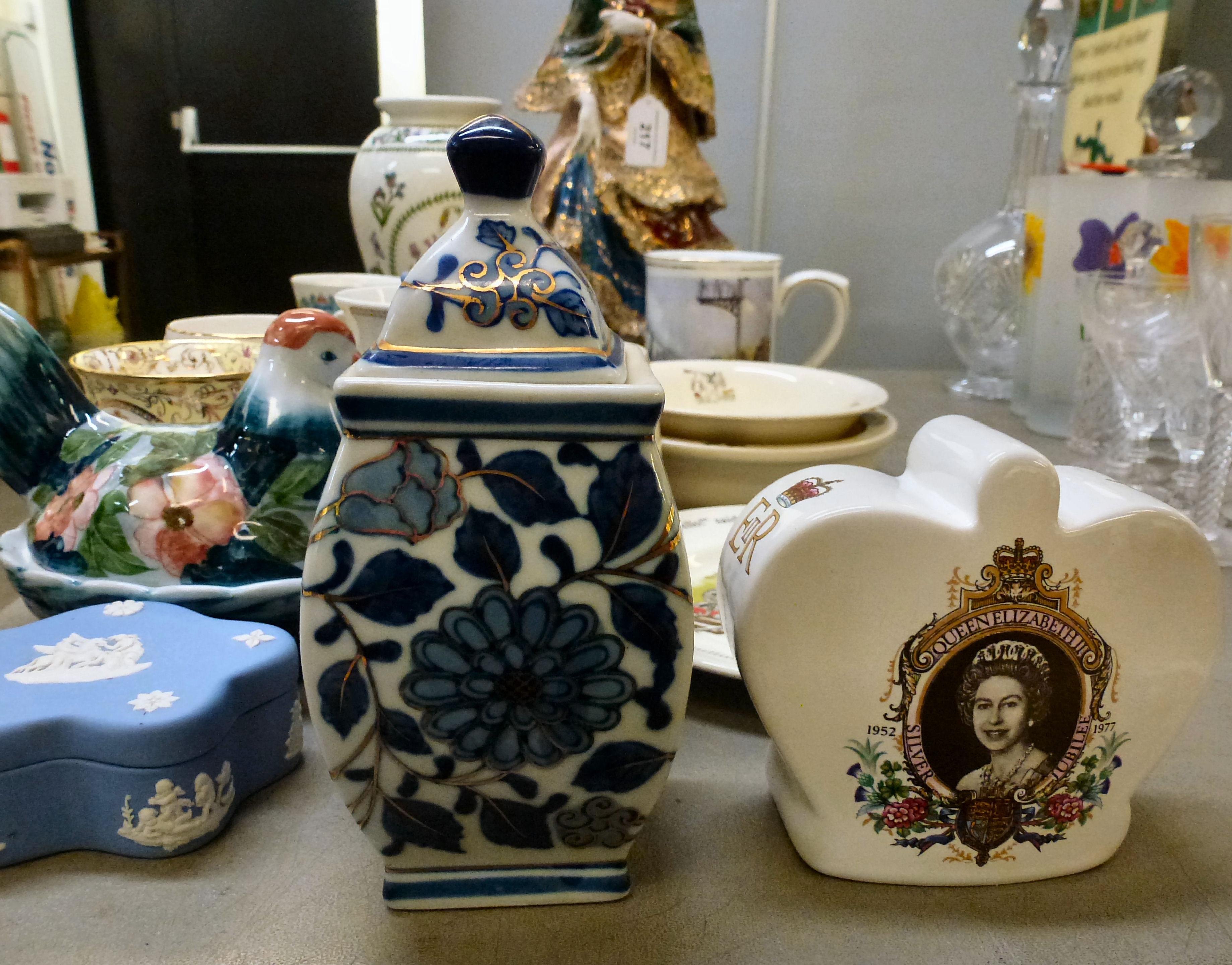 Decorative ceramics: to include a Naples pottery figure, a gowned and ...