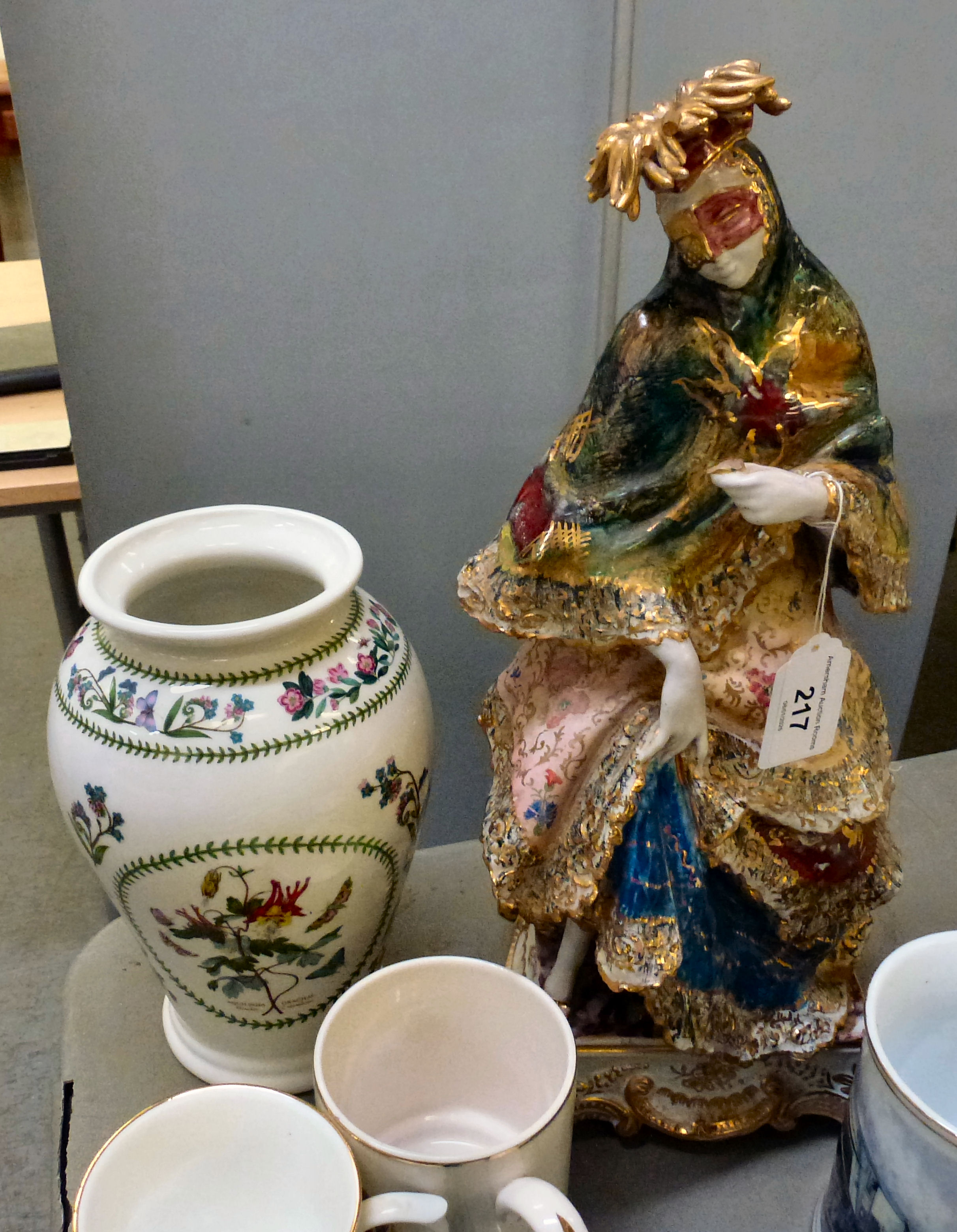 Decorative ceramics: to include a Naples pottery figure, a gowned and ...