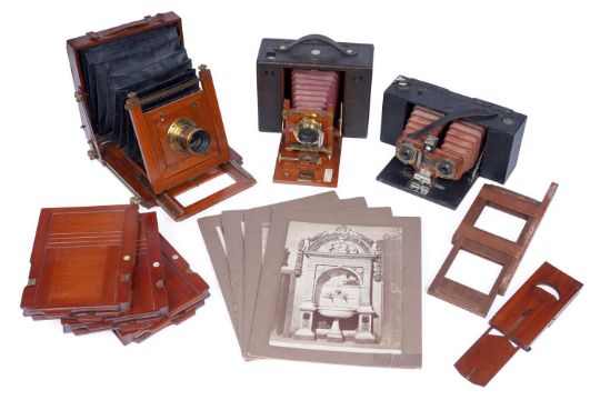 A collection of early 20th Century cameras and accessories, including ...