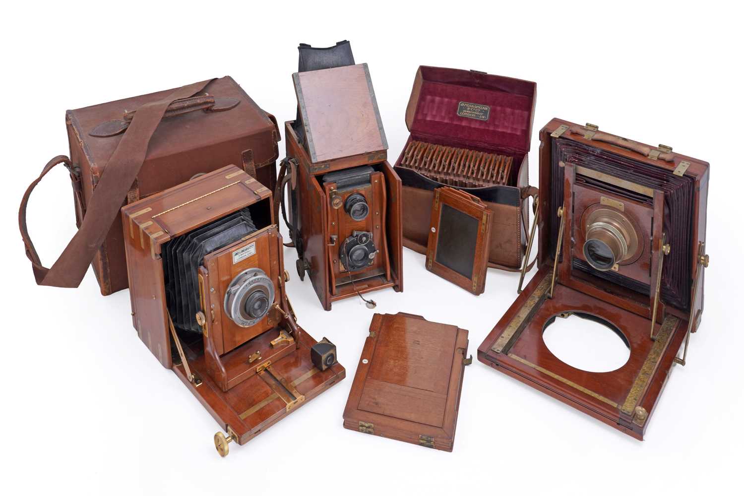 A collection of three Edwardian plate cameras, comprising: a quarter ...