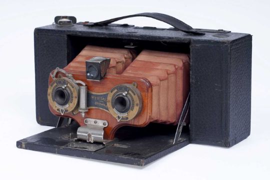 A collection of early 20th Century cameras and accessories, including ...