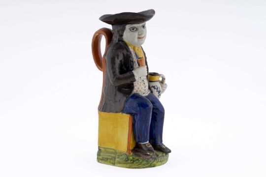 A late 18th Century Pratt ware sailor Toby jug of Rodney type, the ...