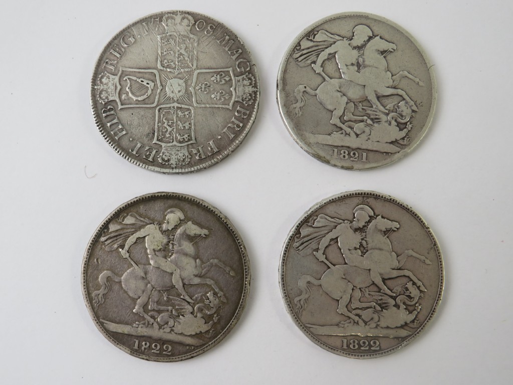 A 1708 Queen Anne silver crown coin and three George IV silver crown ...