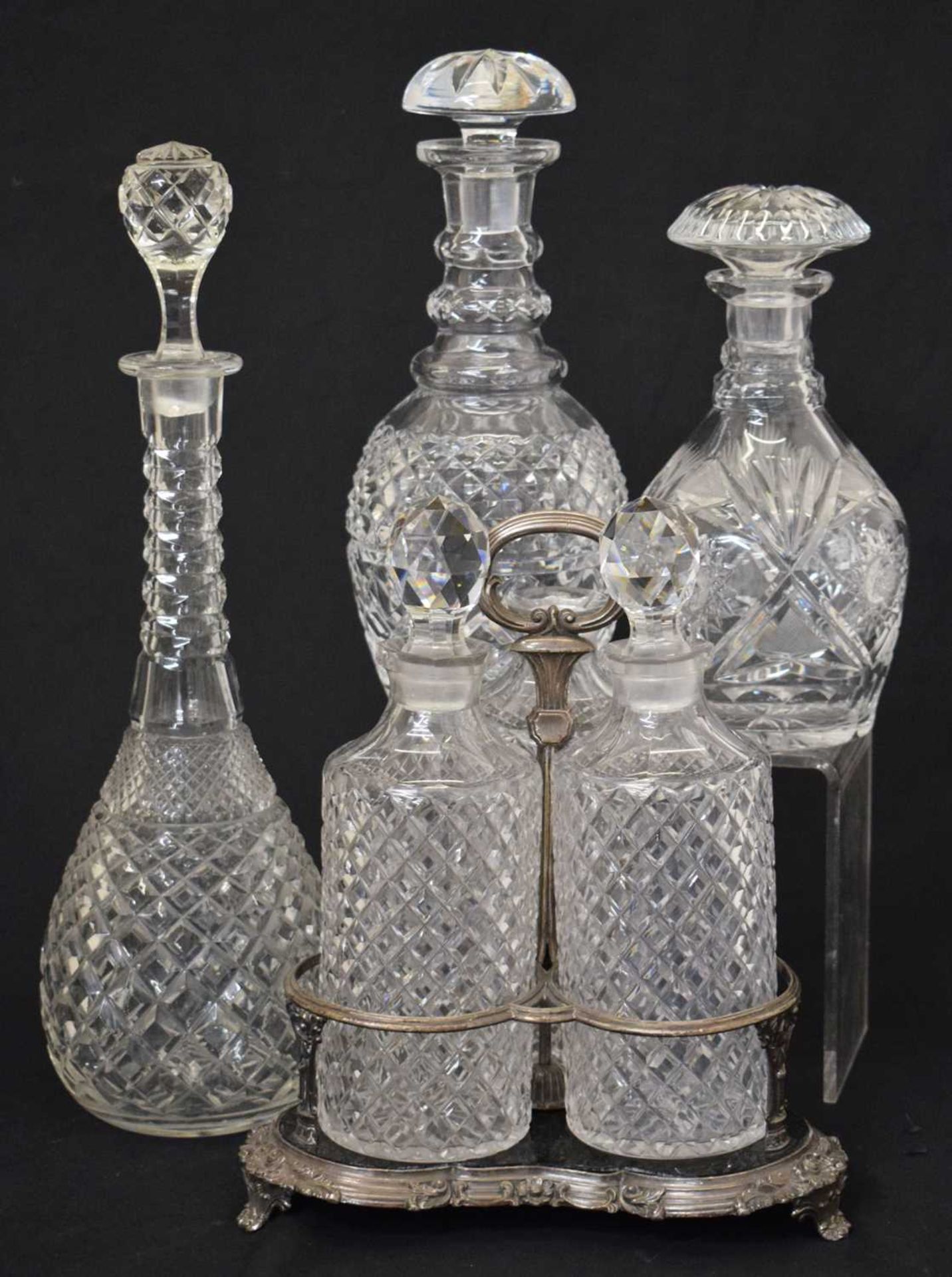 Early 20th century silver plate three bottle decanter stand, of trefoil ...