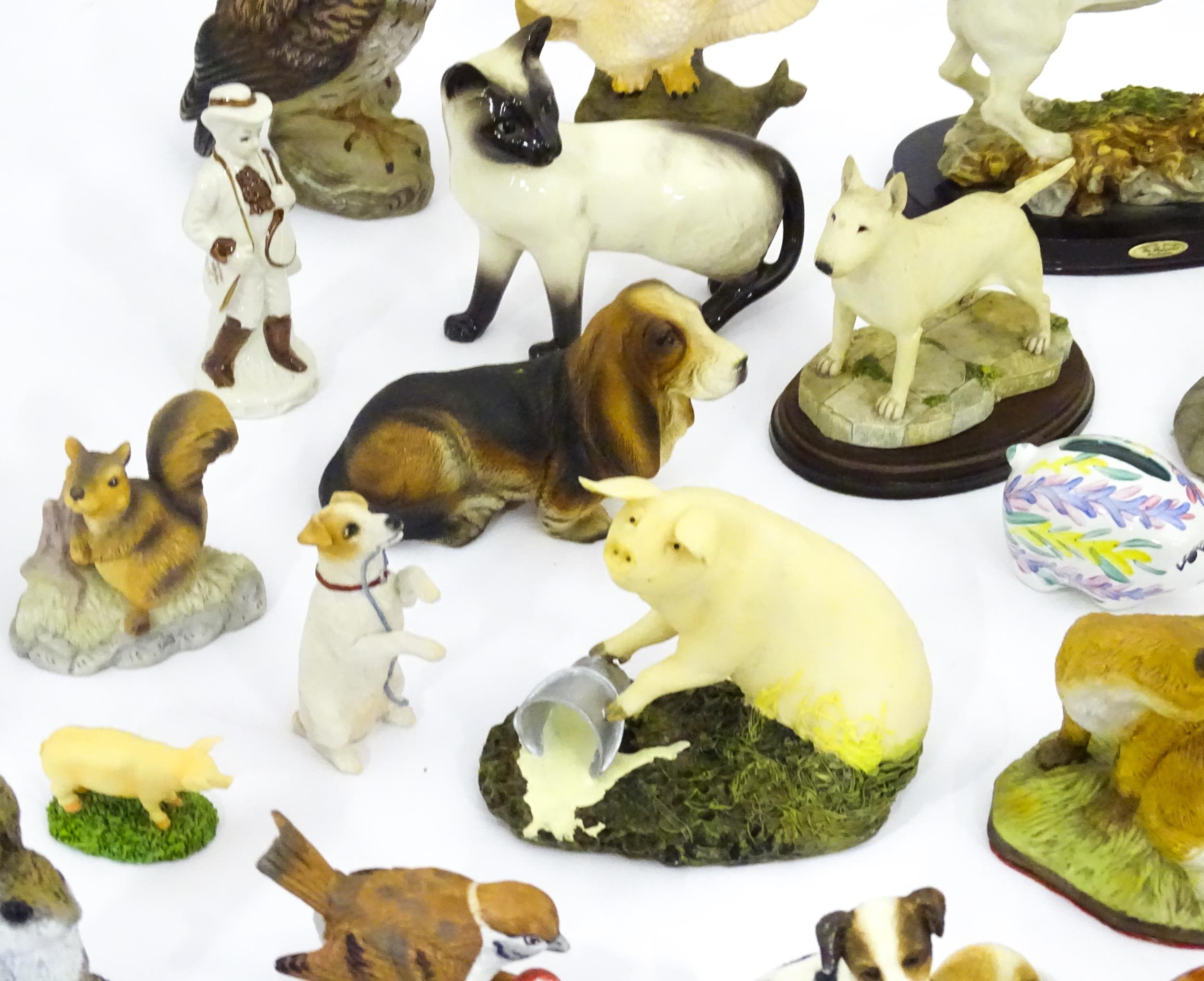 A quantity of assorted models of animals / birds to include cats, dogs ...