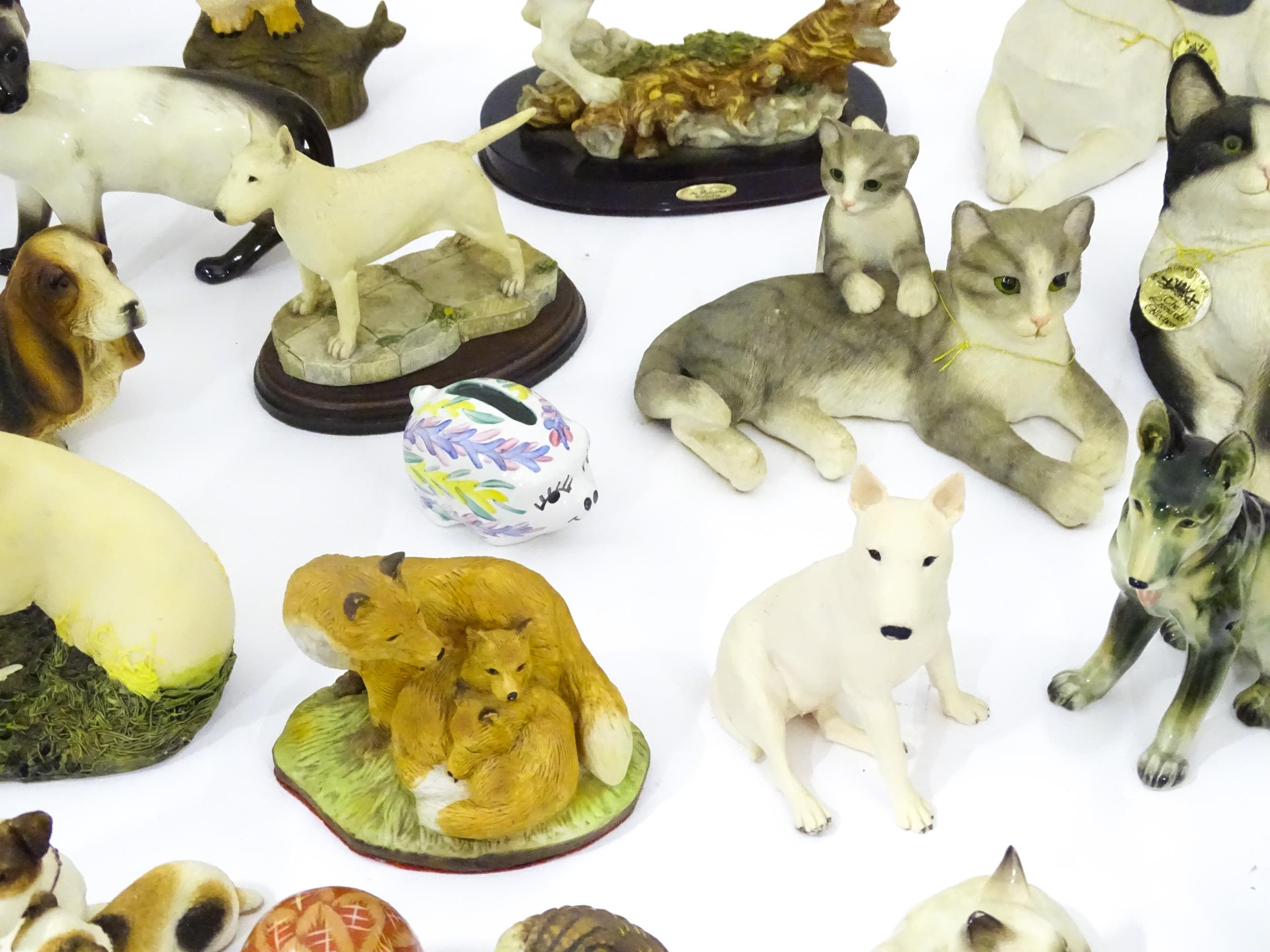 A quantity of assorted models of animals / birds to include cats, dogs ...