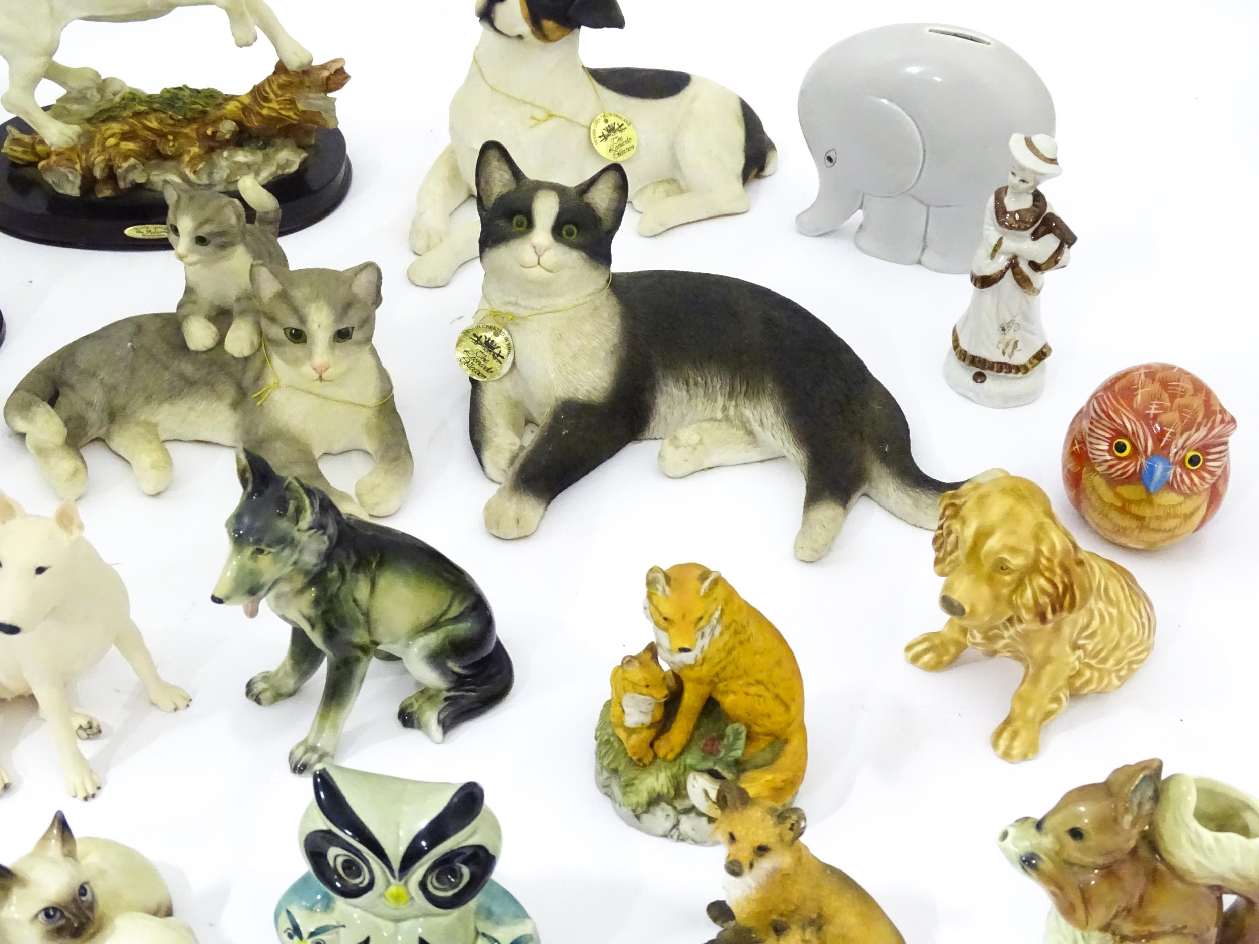 A quantity of assorted models of animals / birds to include cats, dogs ...