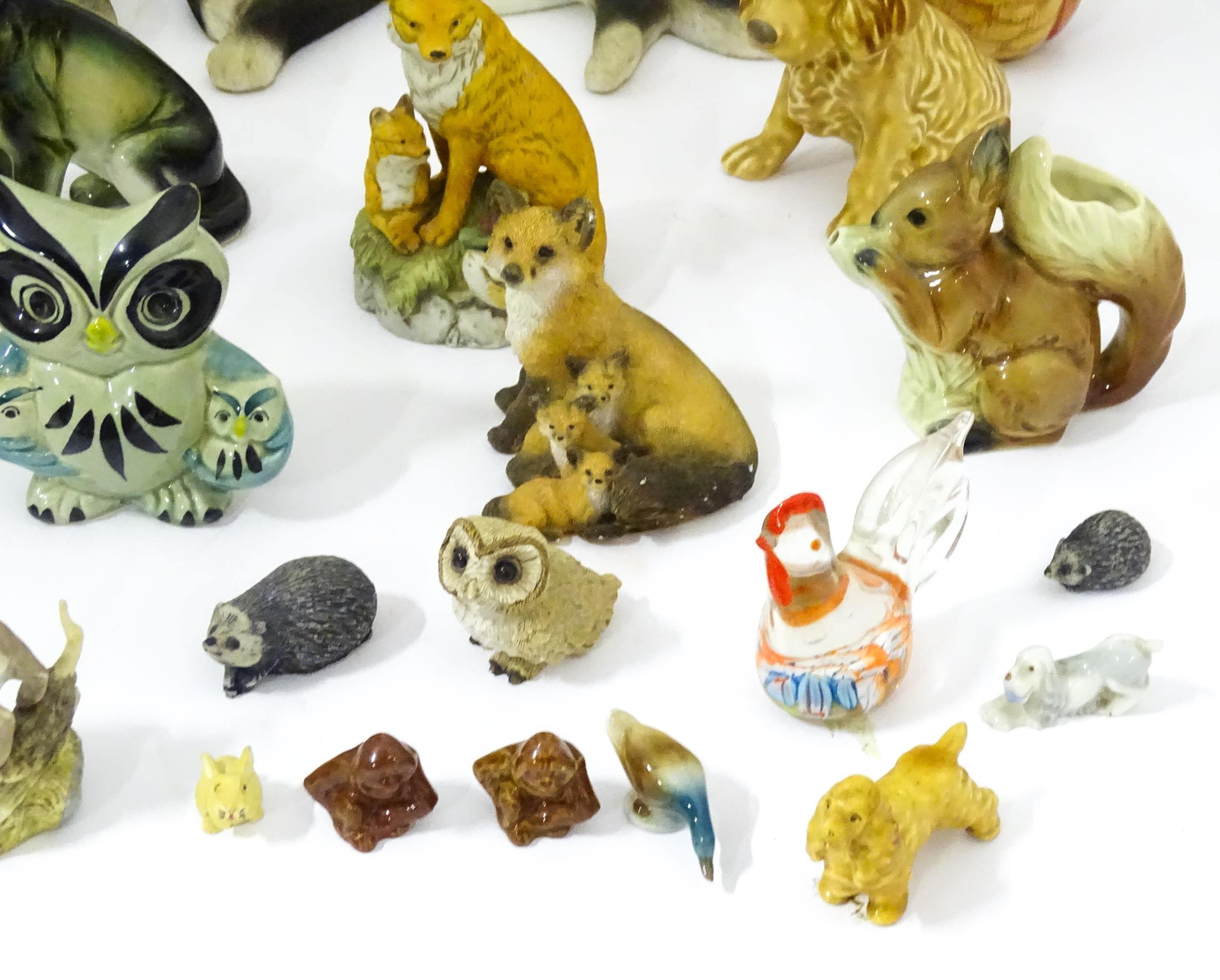 A quantity of assorted models of animals / birds to include cats, dogs ...