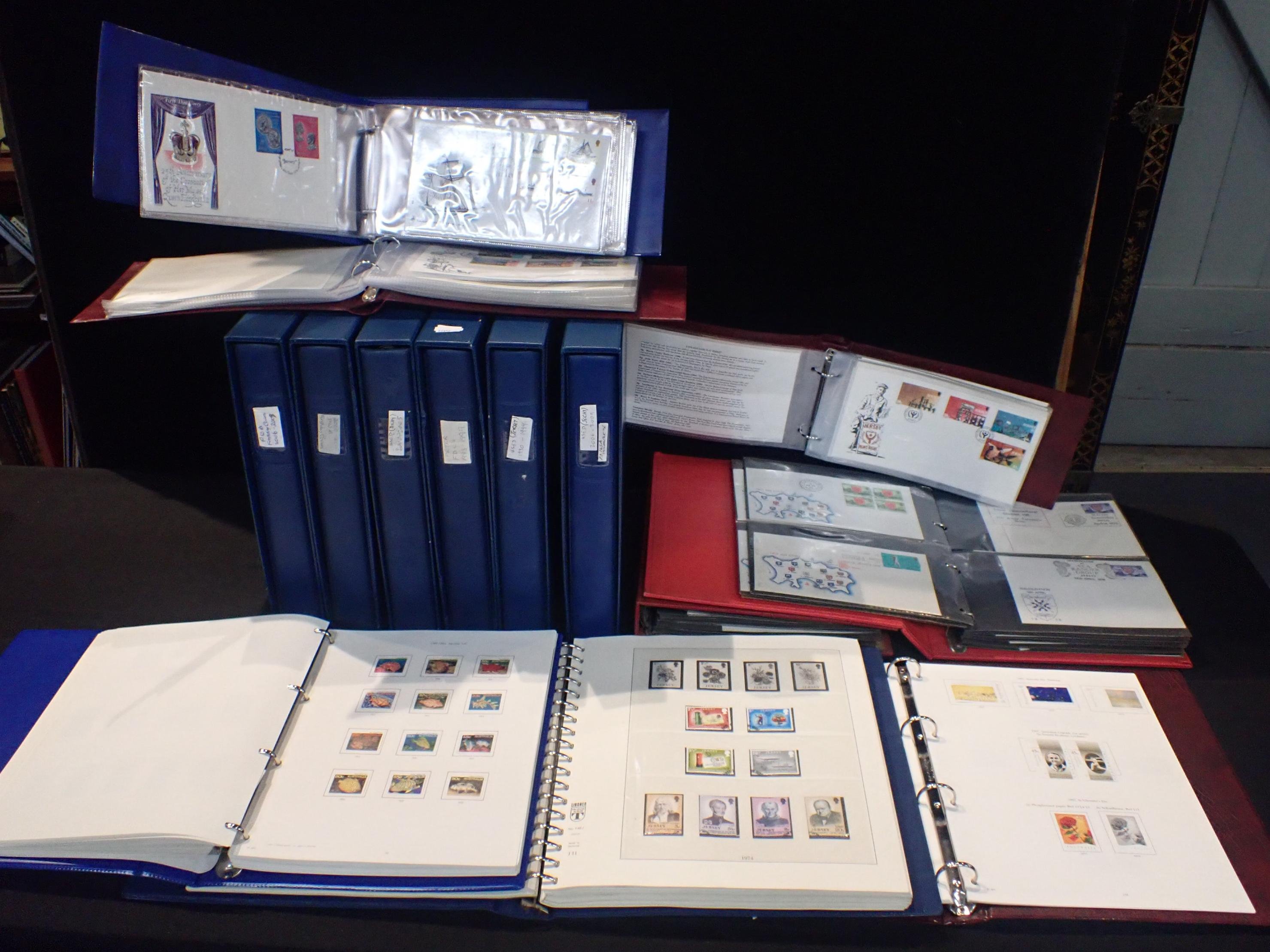 STAMPS IN 15 VOLUMES WITH A F. USED JERSEY COLLECTIONin four hingeless ...