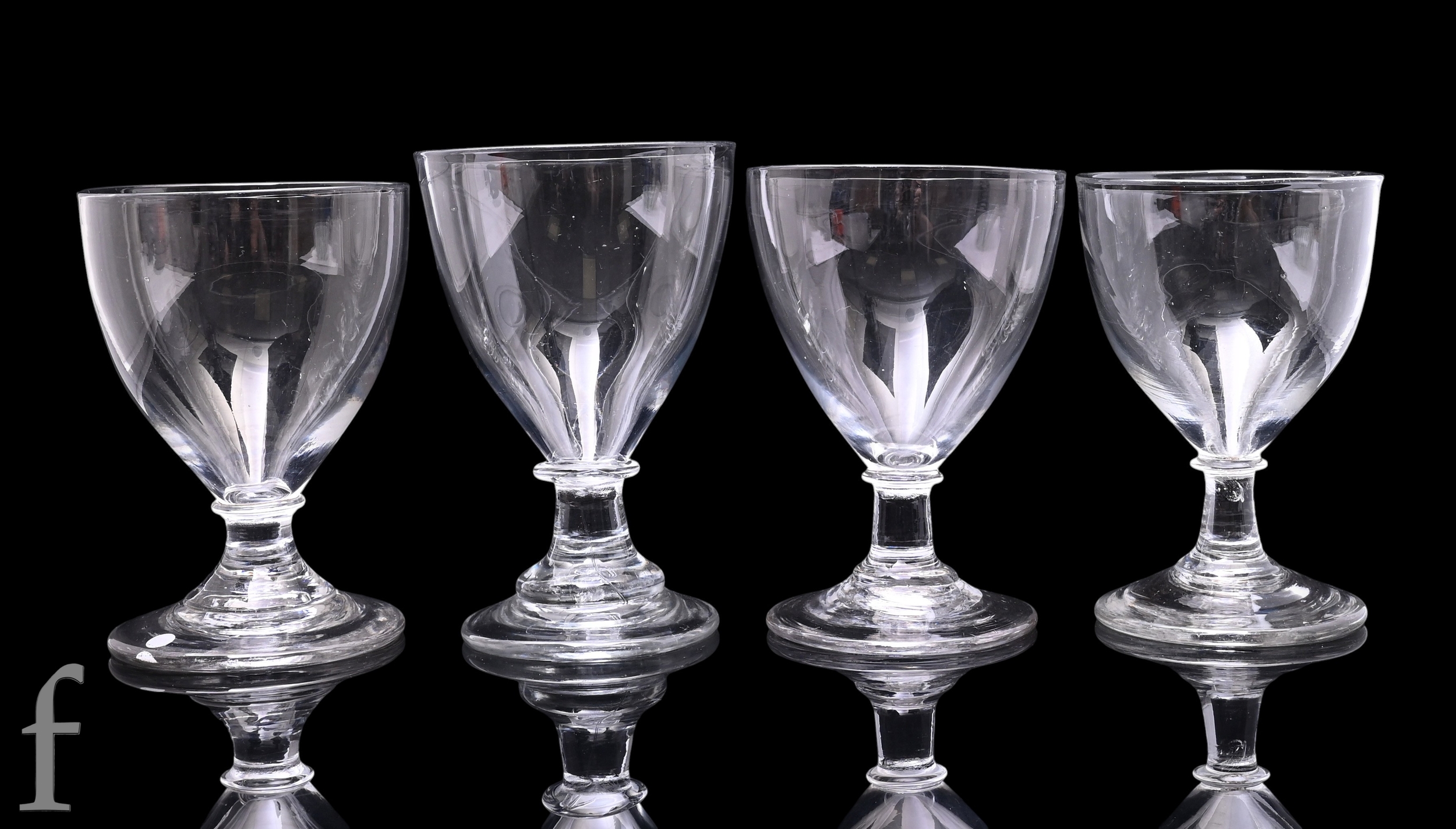 A matched pair of late 18th Century glass rummers, the pointed bowl on ...