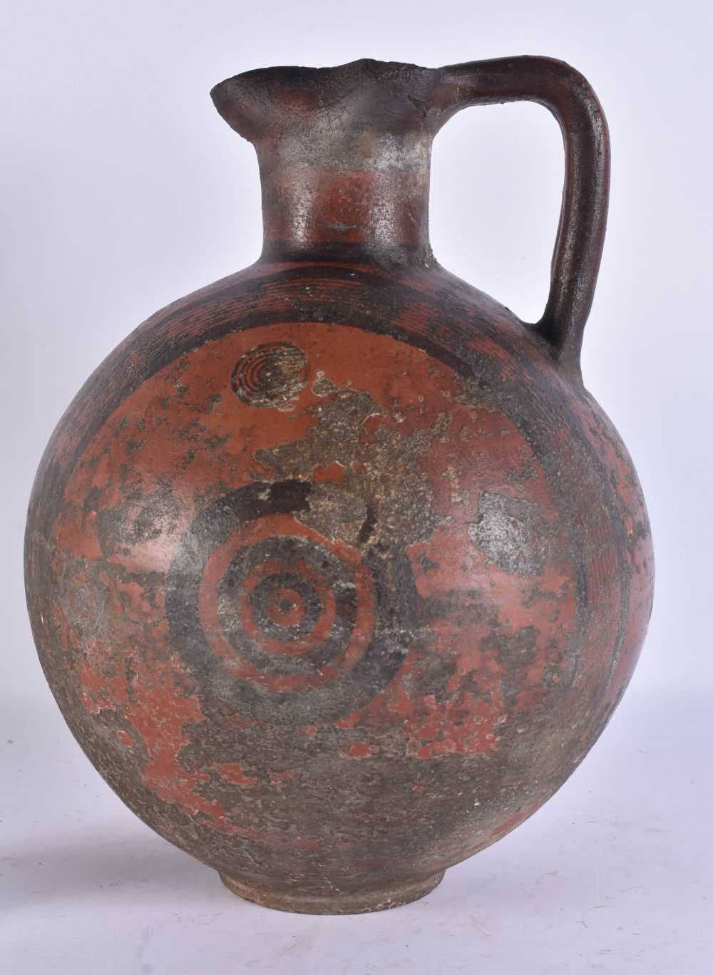 A LARGE ANCIENT CYPRIOT BLACK ON RED POTTERY OENOCHOE the spherical ...
