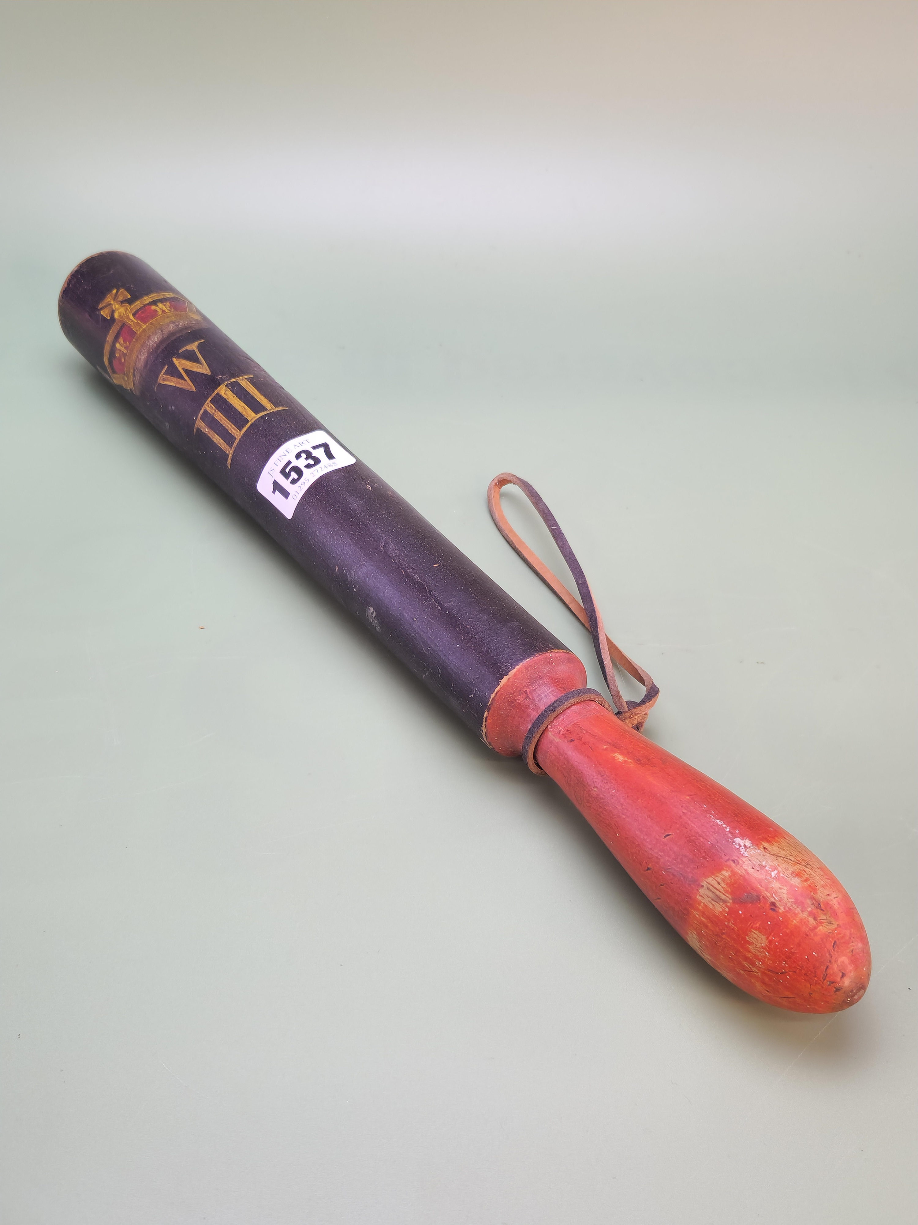 A William III truncheon, the black ground painted with his crowned cypher