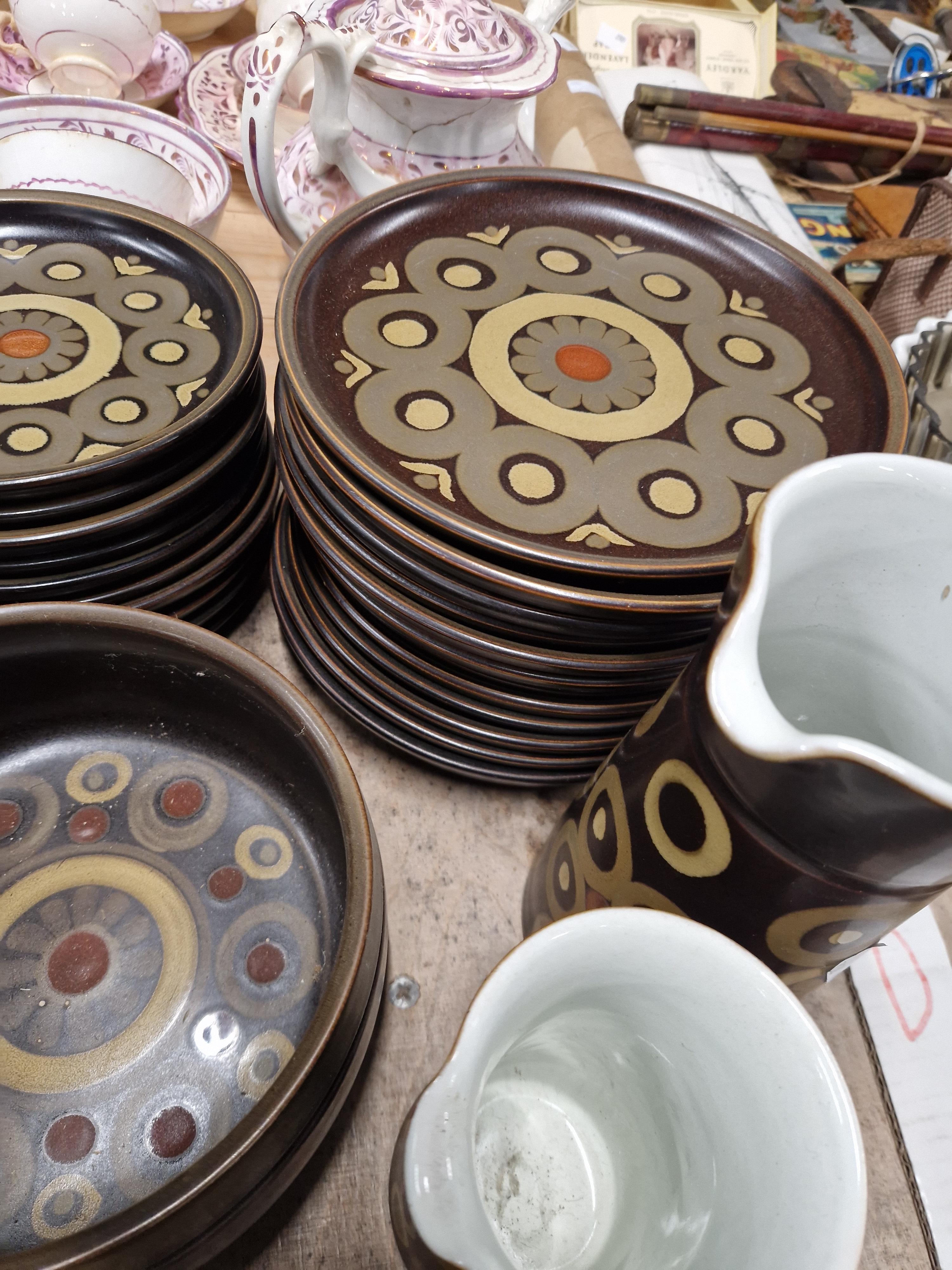 An extensive service of Denby brown stonewares
