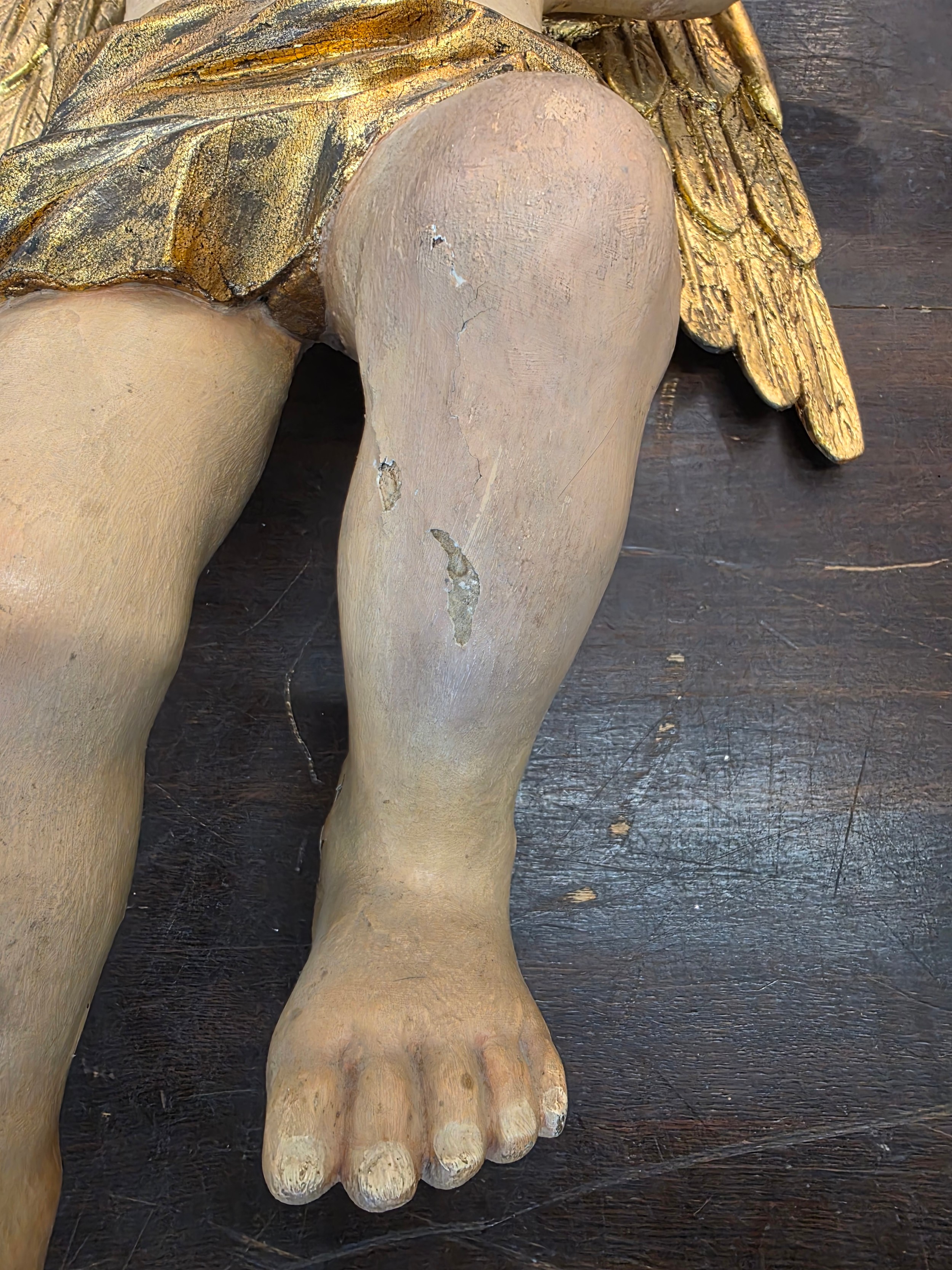 A pair of winged putti cherubs, from Poland, both with some breaks and ...
