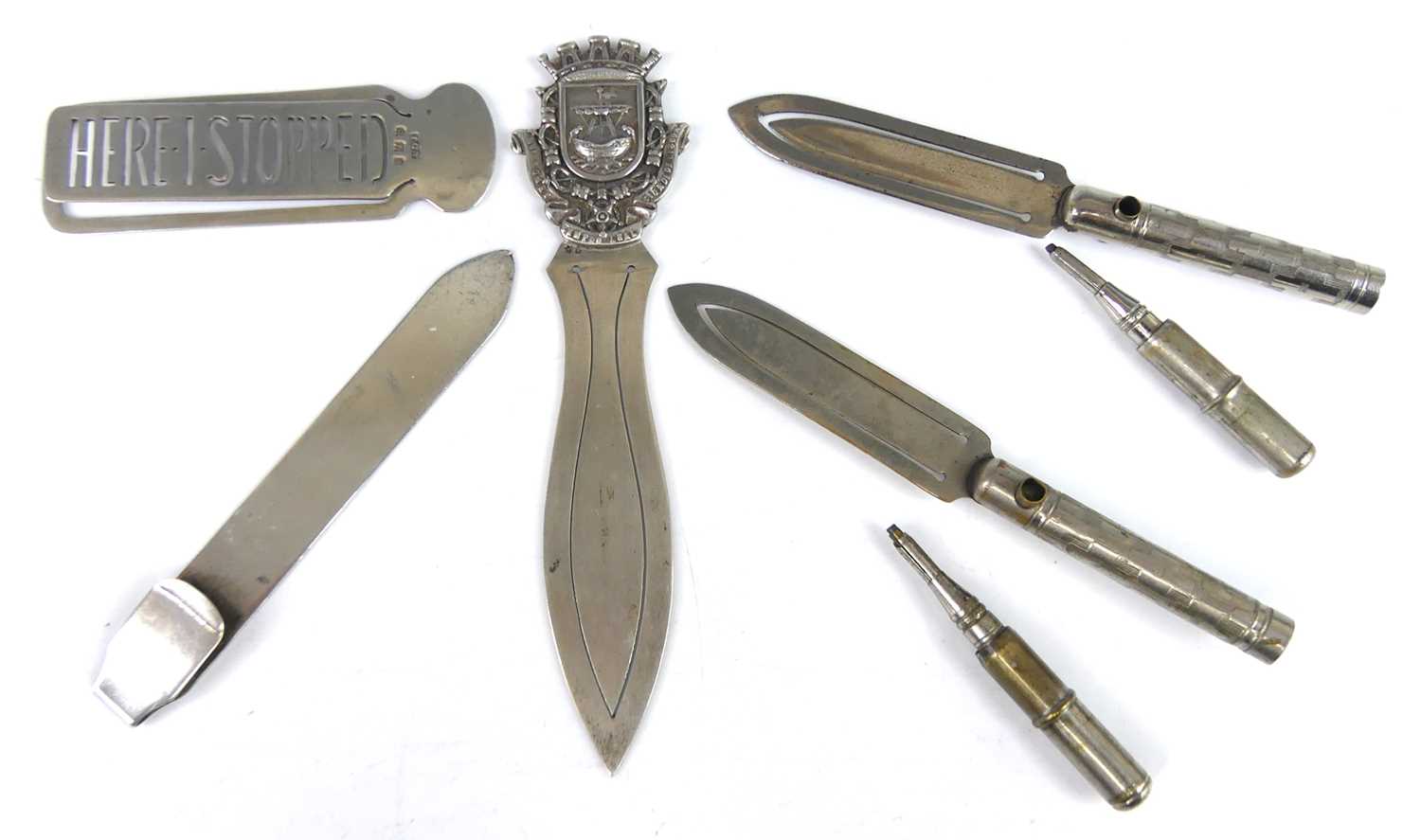 Three silver clip bookmarks, comprising a plain folded example, maker ...