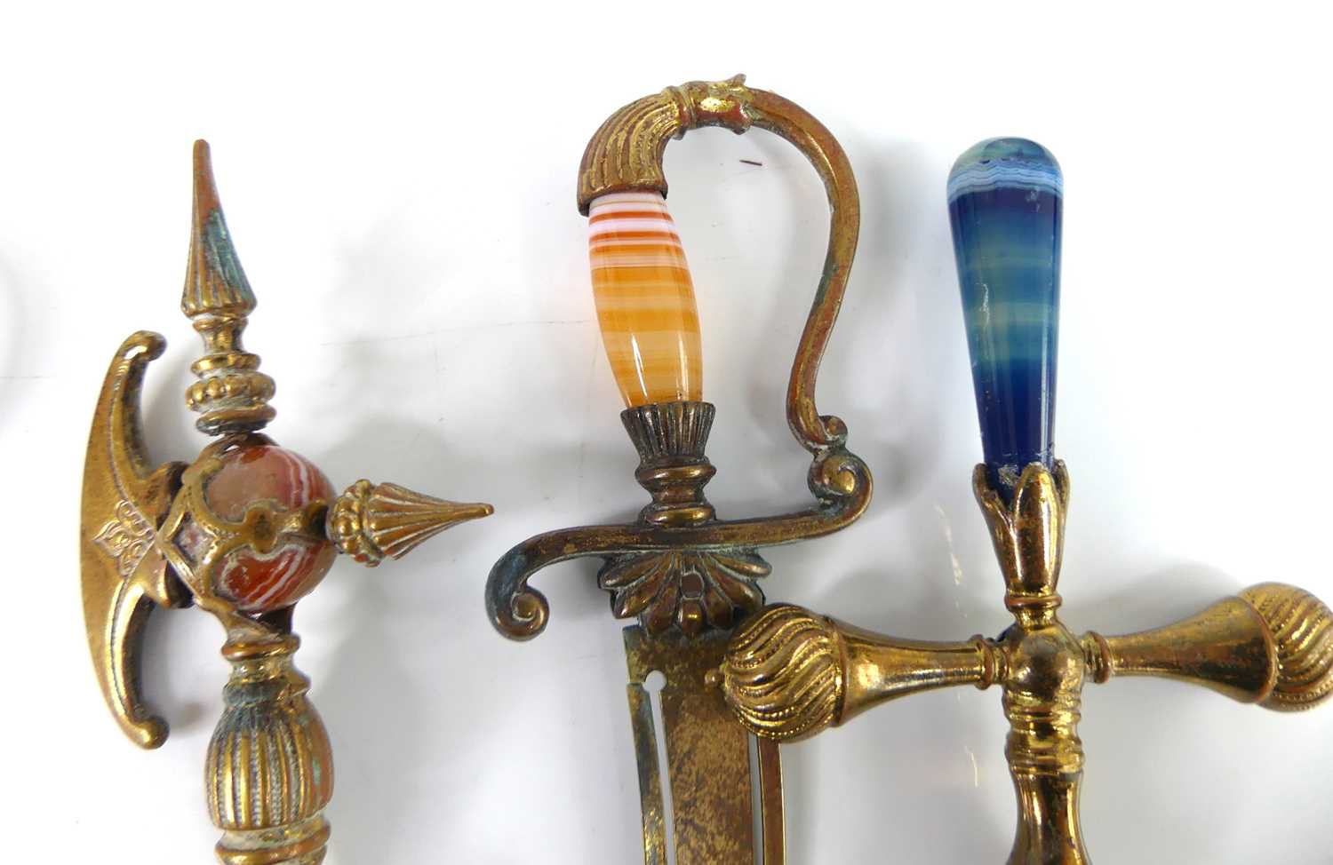 Three Victorian brass novelty bookmarks in the form of sabres, two ...