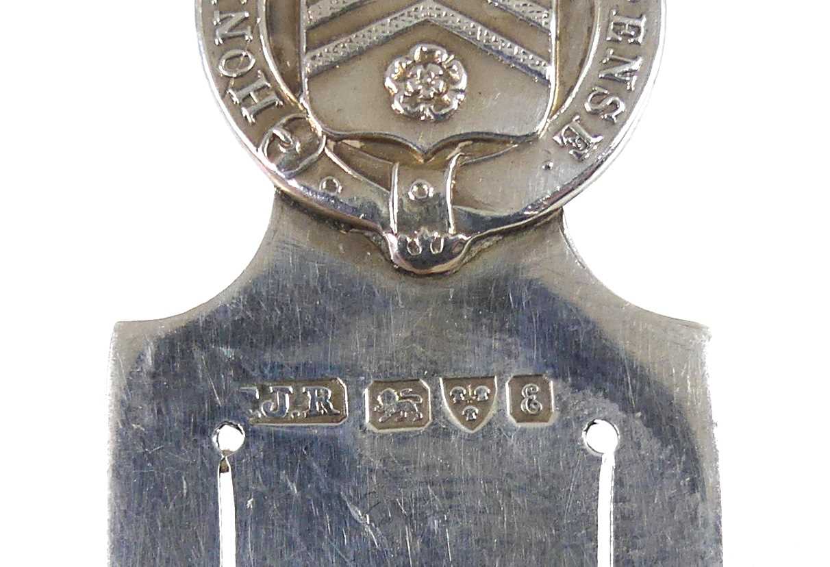 Three Edwardian silver armorial clip bookmarks, comprising one with ...