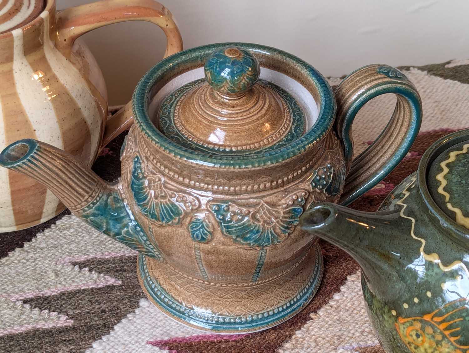 A collection of studio pottery teapots, to include examples by Sean ...