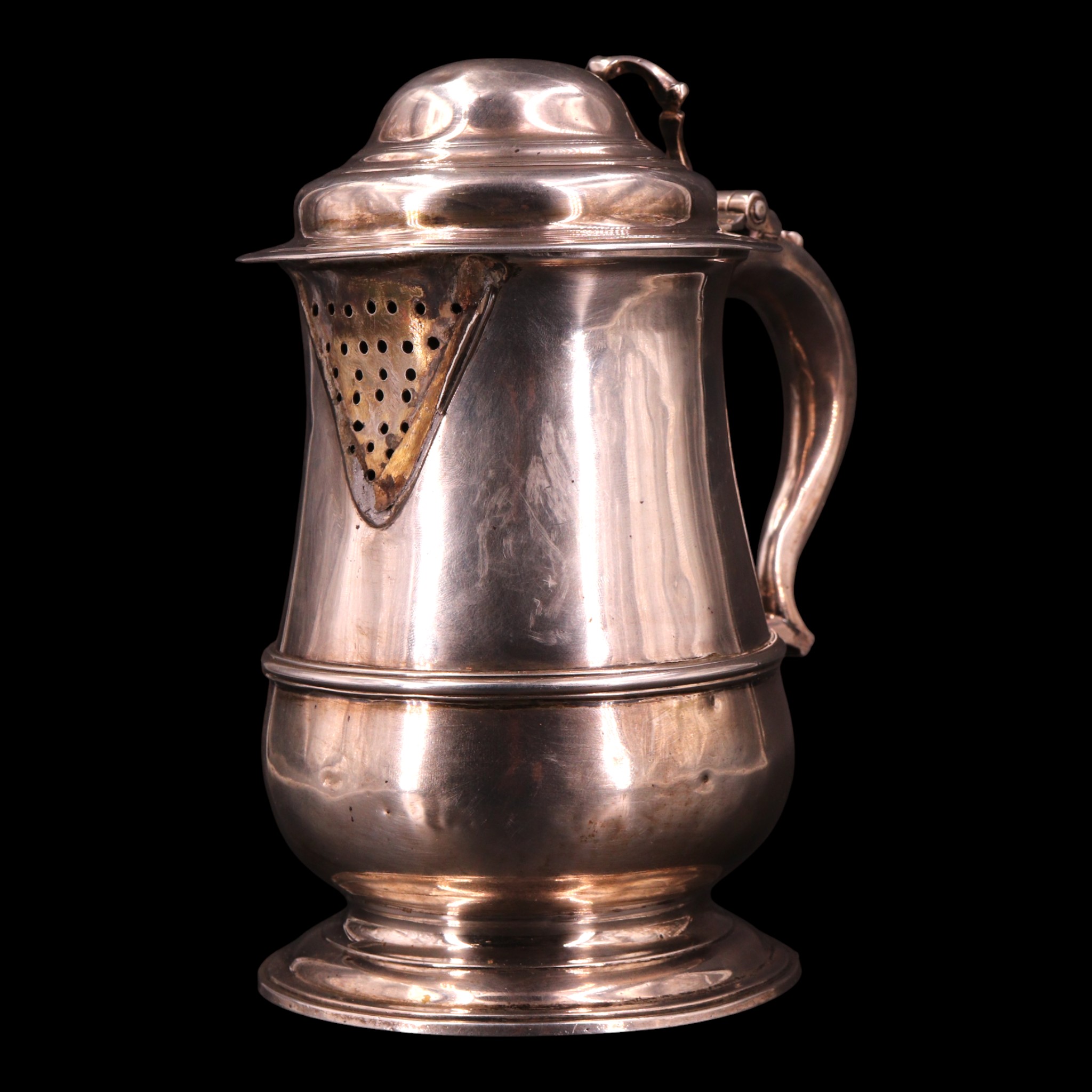 A George II silver baluster tankard, having a moulded-domed hinged lid ...