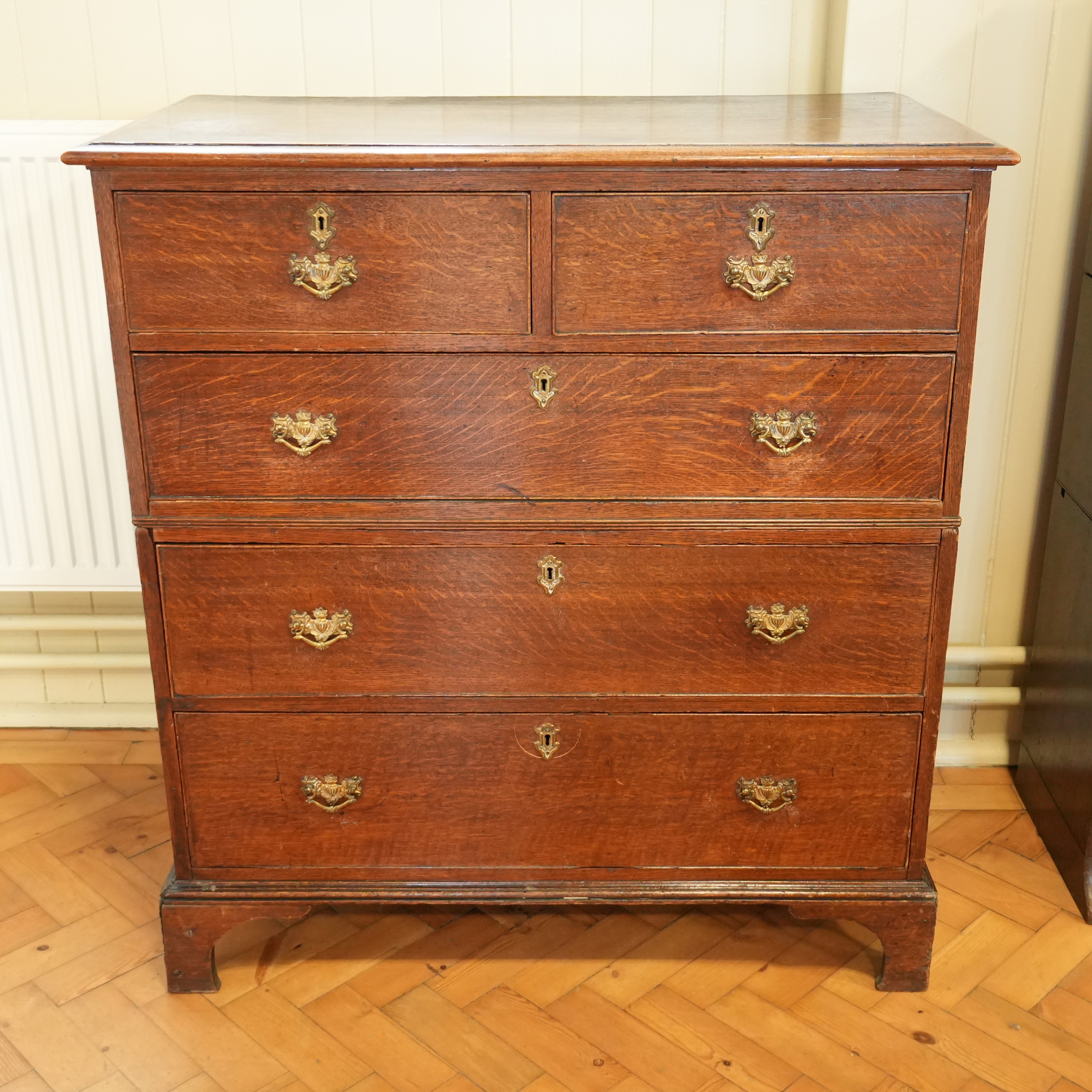 An early-to-mid 19th Century oak chest of drawers, 98 cm x 52 cm x 105 cm