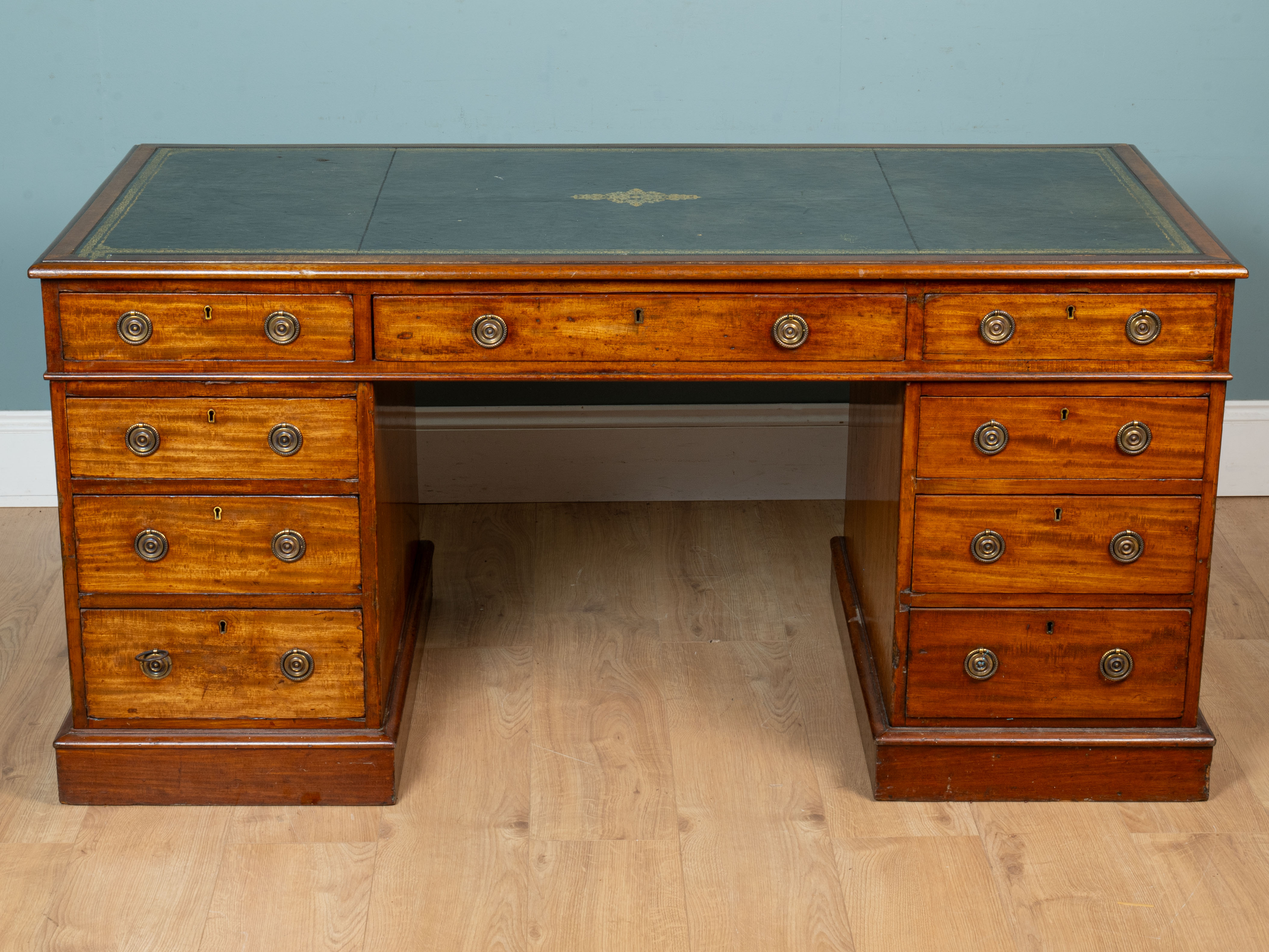 A Victorian mahogany pedestal desk With a green leather tooled gilt ...