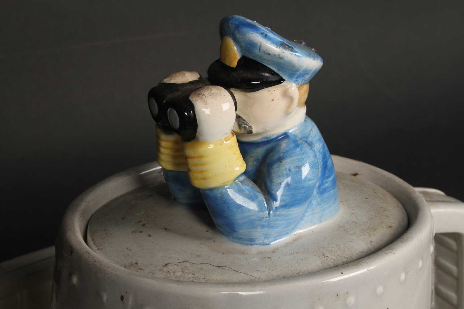A pottery jardiniere, marked D.P. HOVE, with a ceramic novelty teapot ...