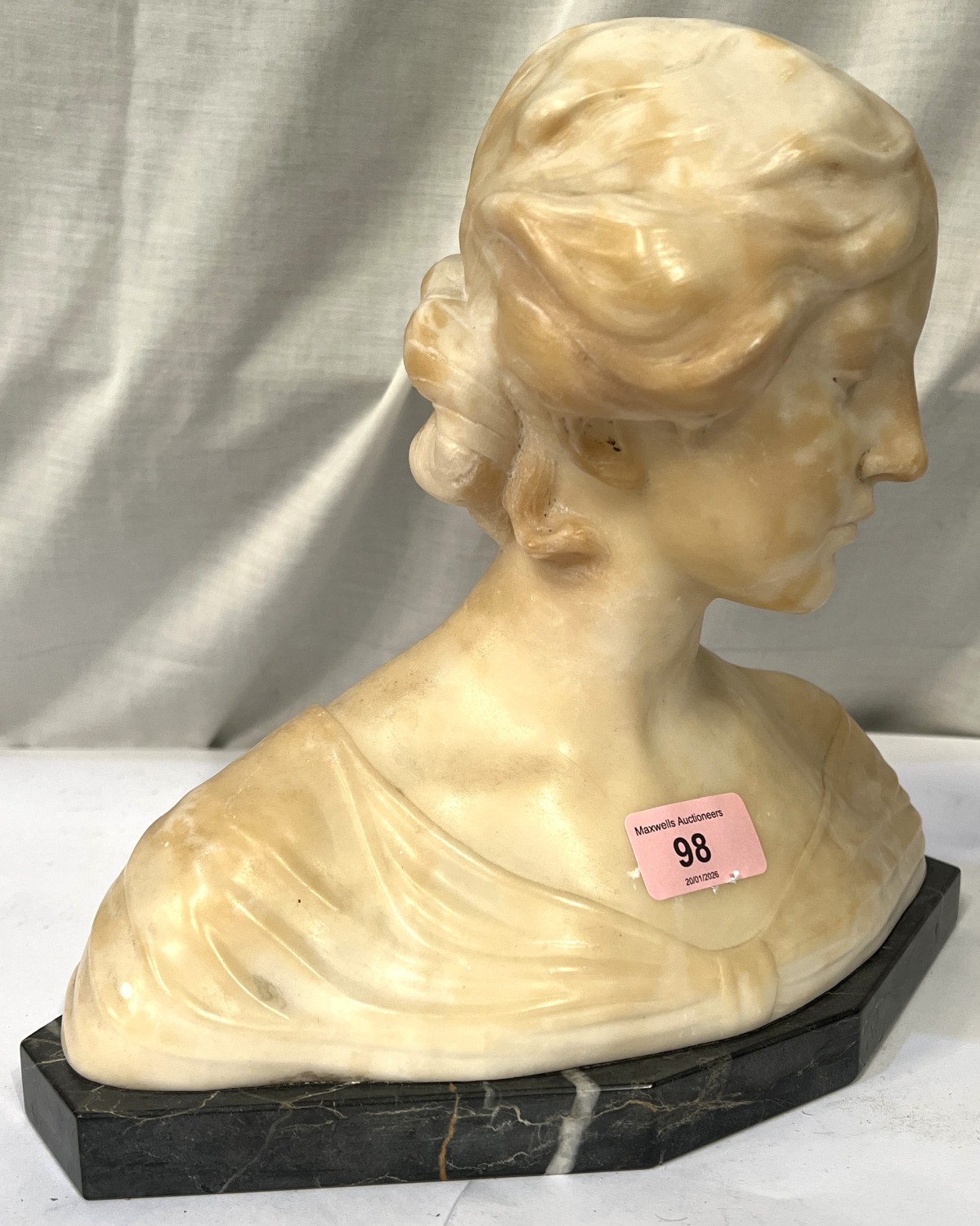An Art Deco alabaster head and shoulders bust of a young woman, on ...